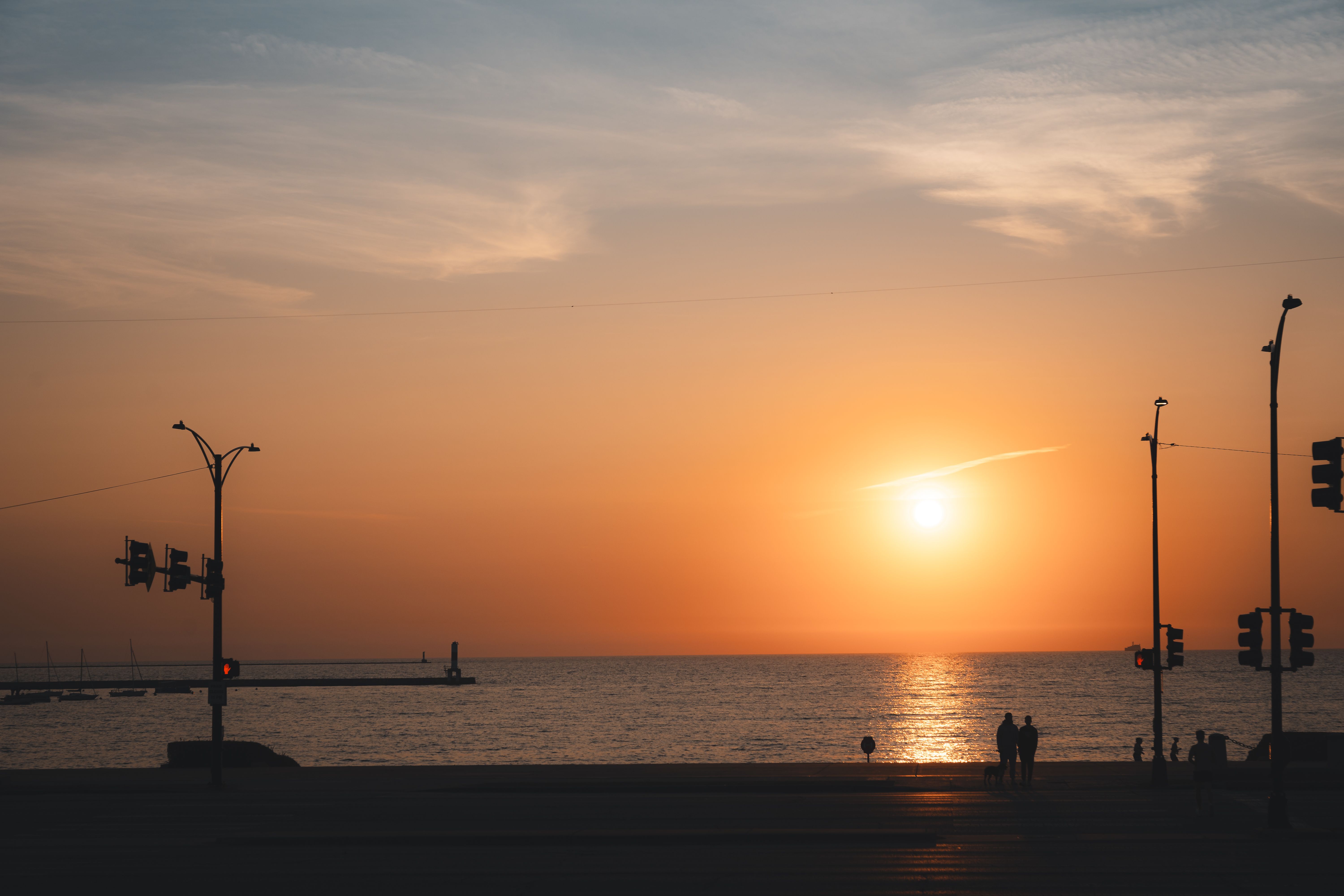 Scenic Coastal Sunset with Silhouettes · Free Stock Photo