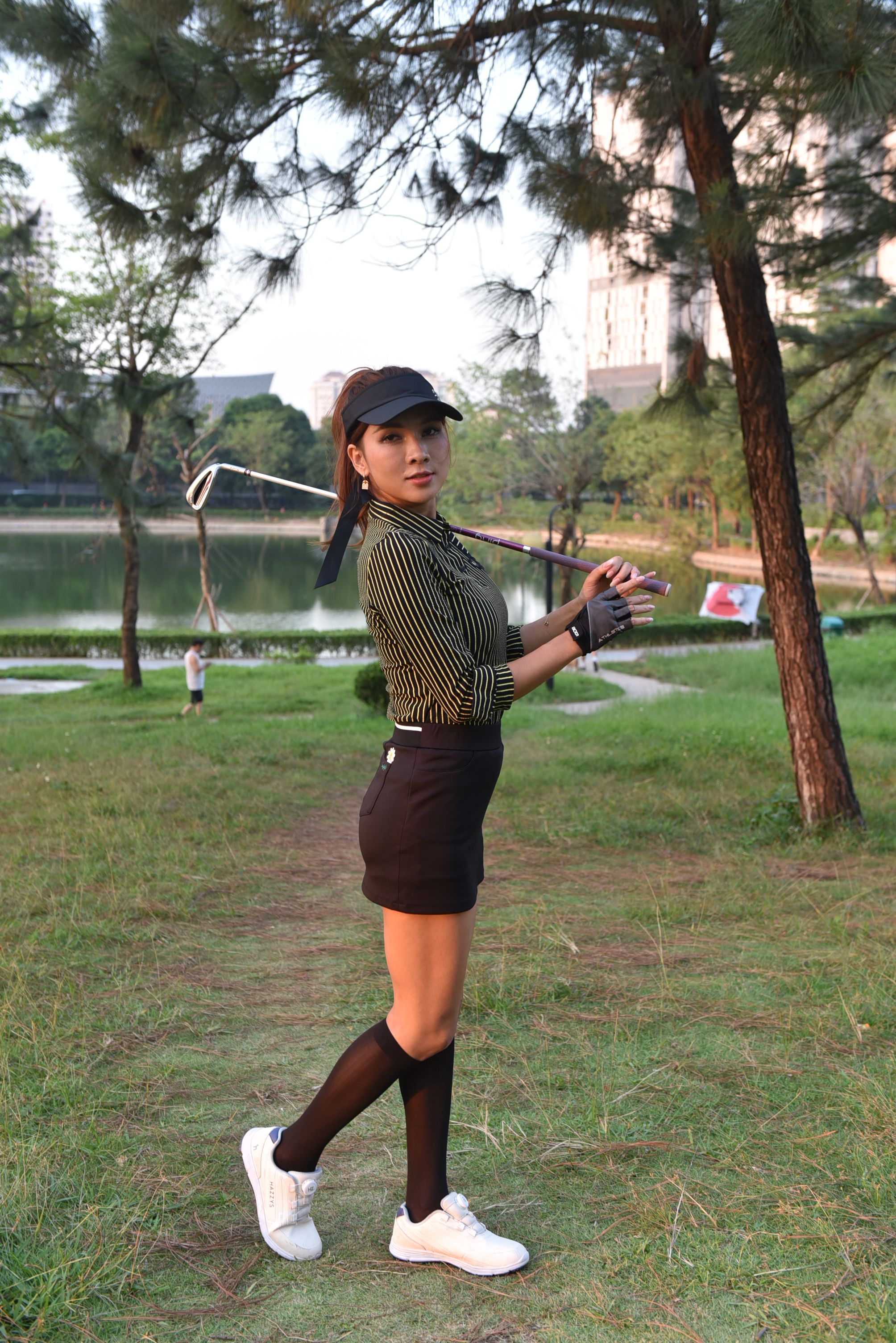 Young Woman Enjoying Golf on Sunny Day · Free Stock Photo