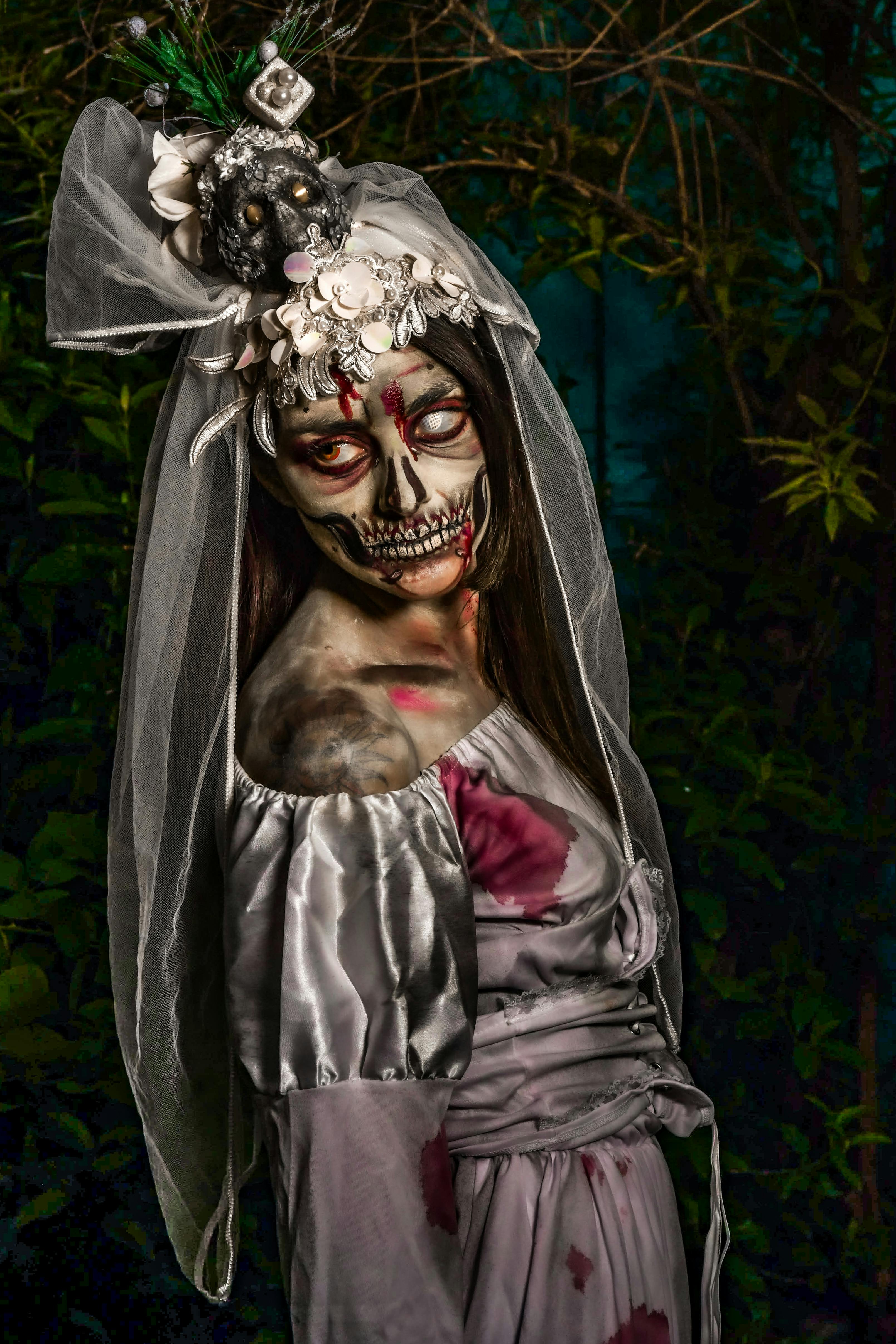 Haunting Skull Makeup in Spooky Forest Theme · Free Stock Photo