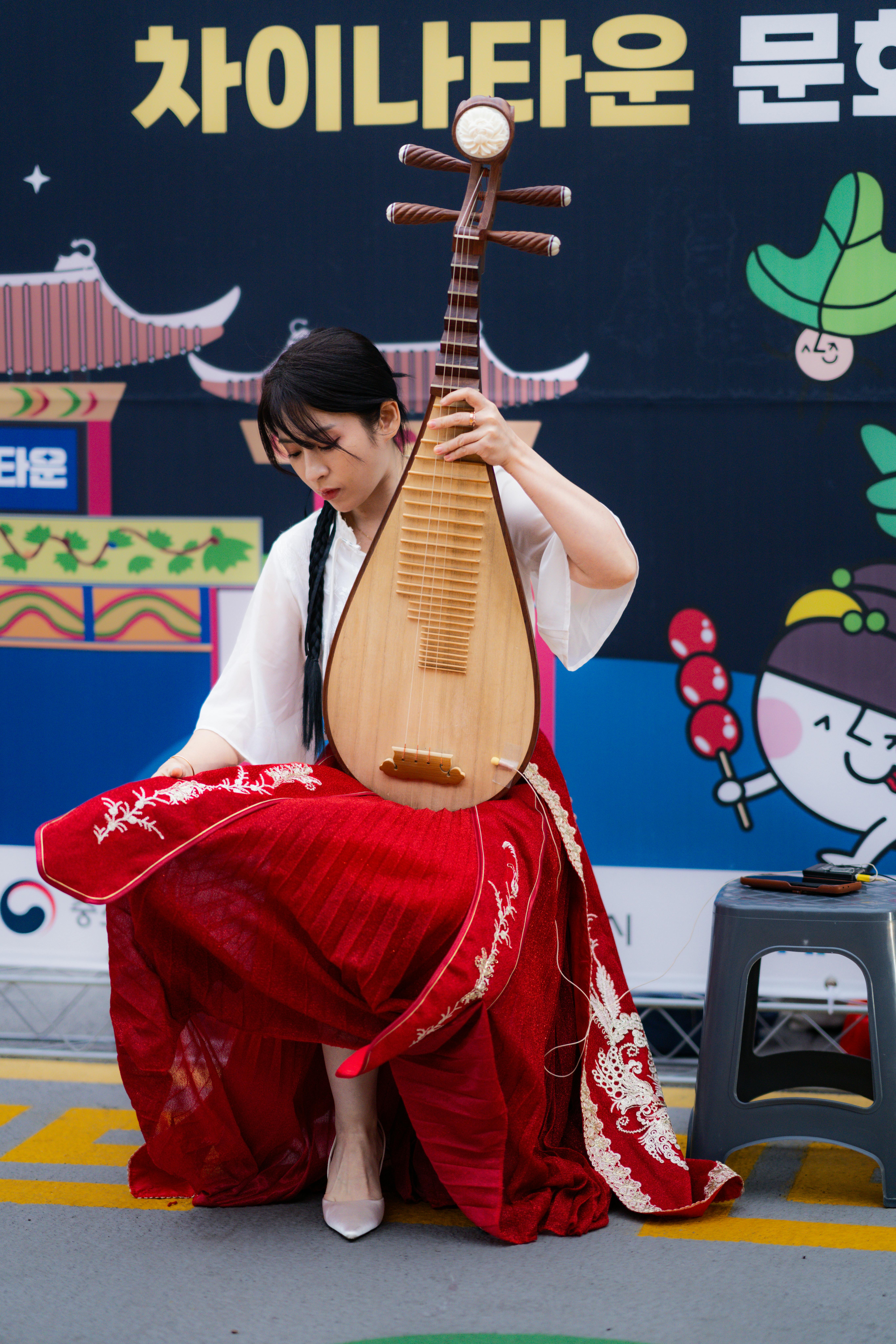 Traditional Chinese Musician Playing Pipa · Free Stock Photo