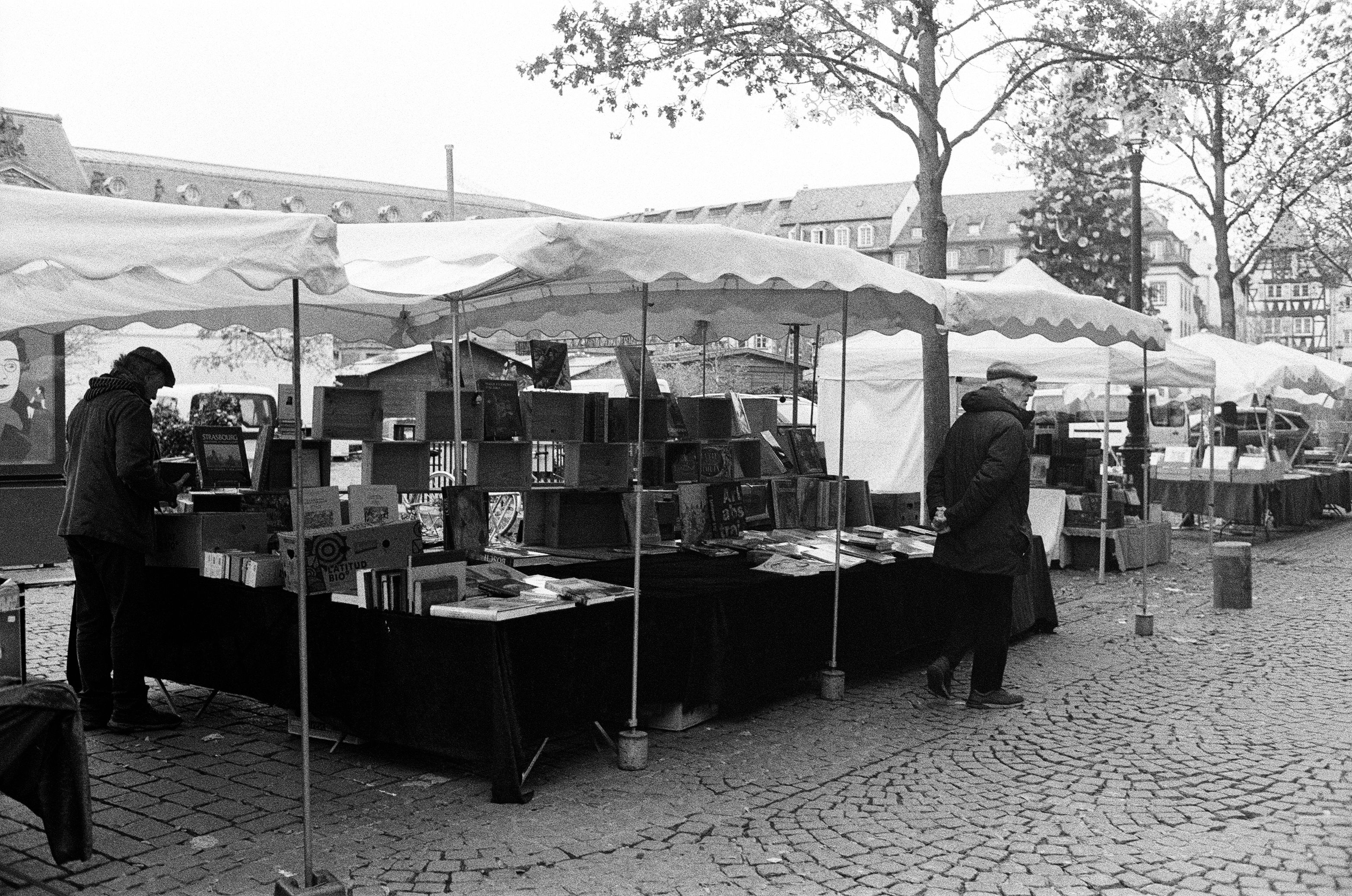Black and White Outdoor Book Market Scene · Free Stock Photo