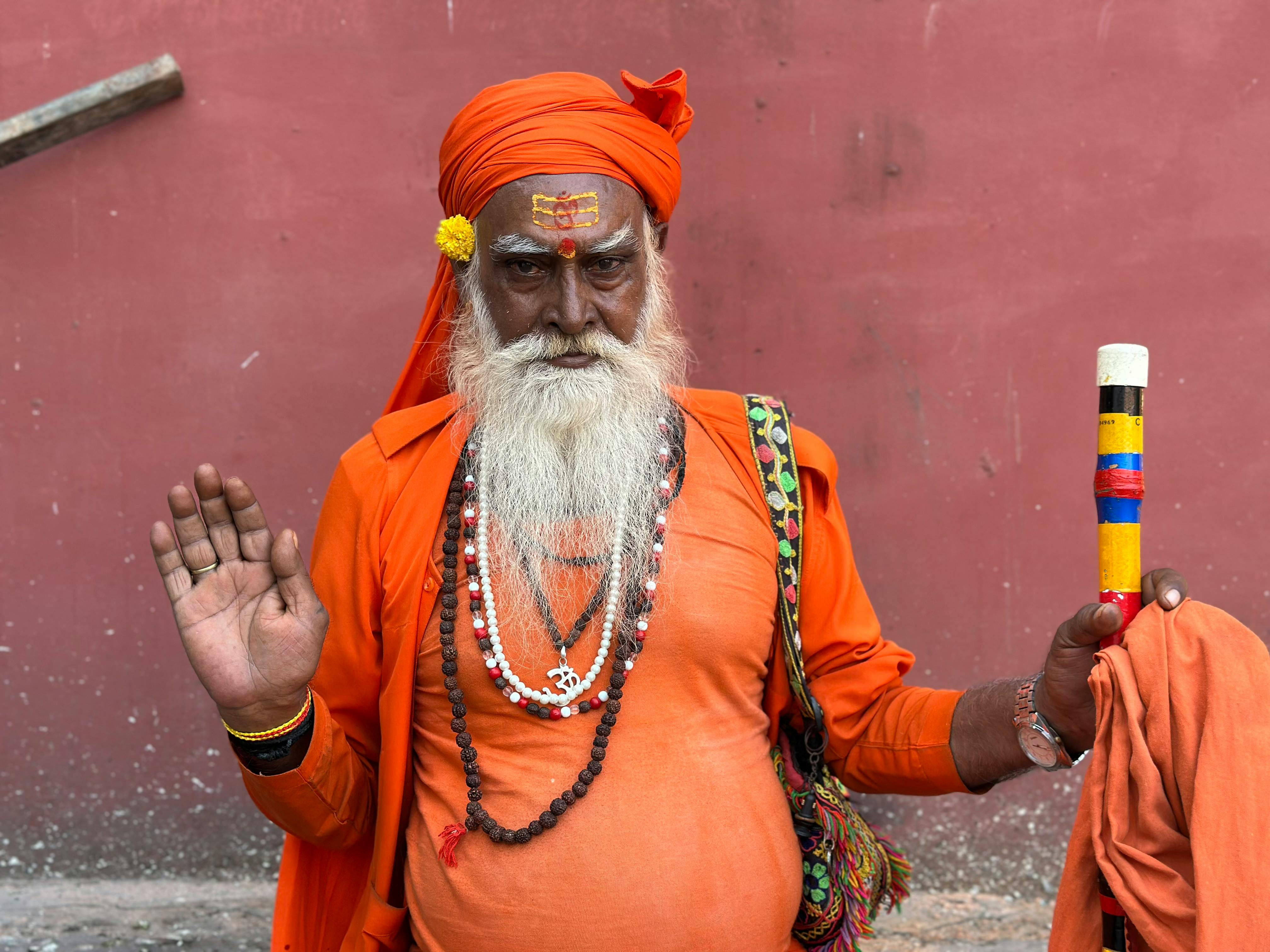 Portrait of a Sadhu in Traditional Orange Attire · Free Stock Photo