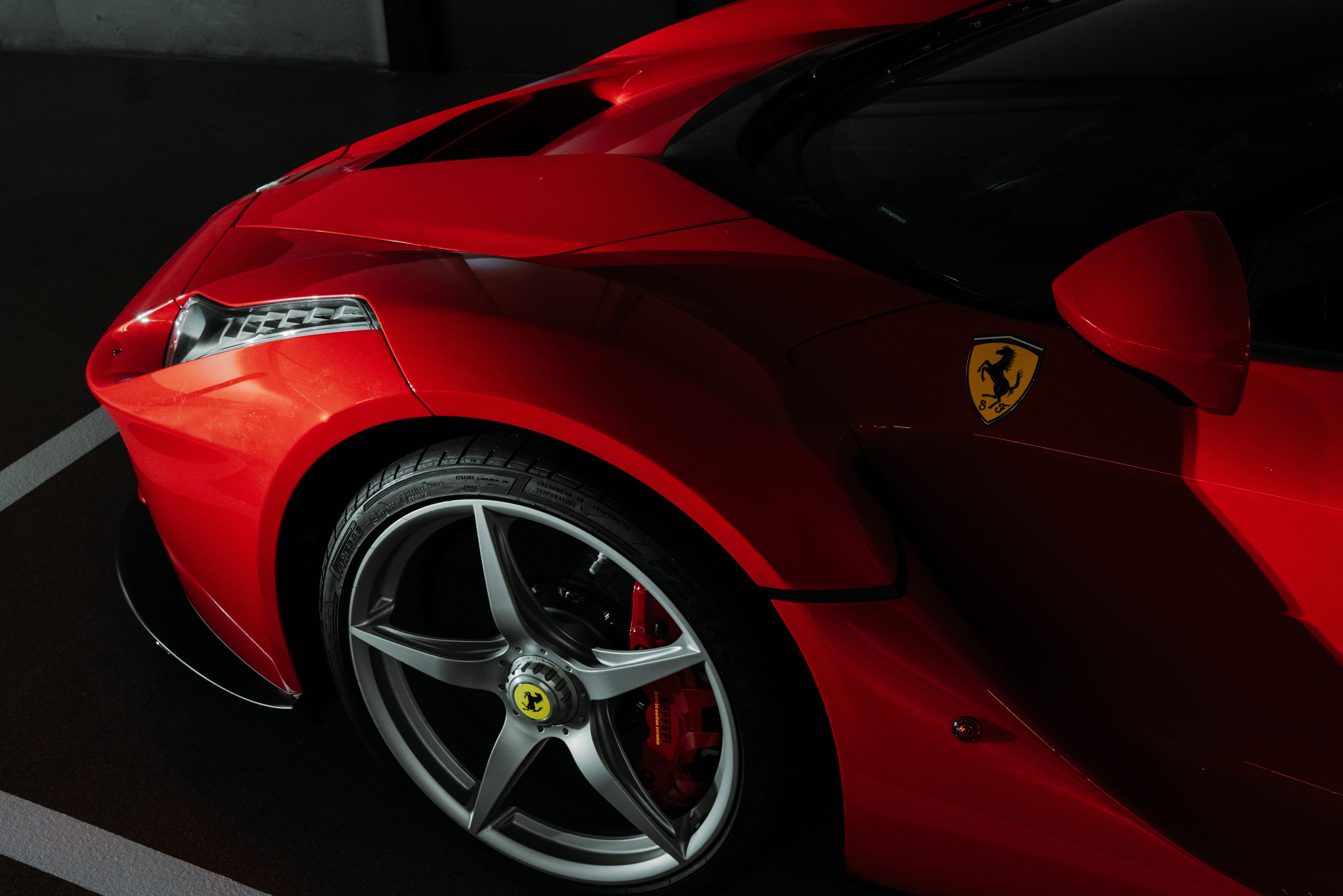 Sleek Red Sports Car Close-Up in Garage · Free Stock Photo