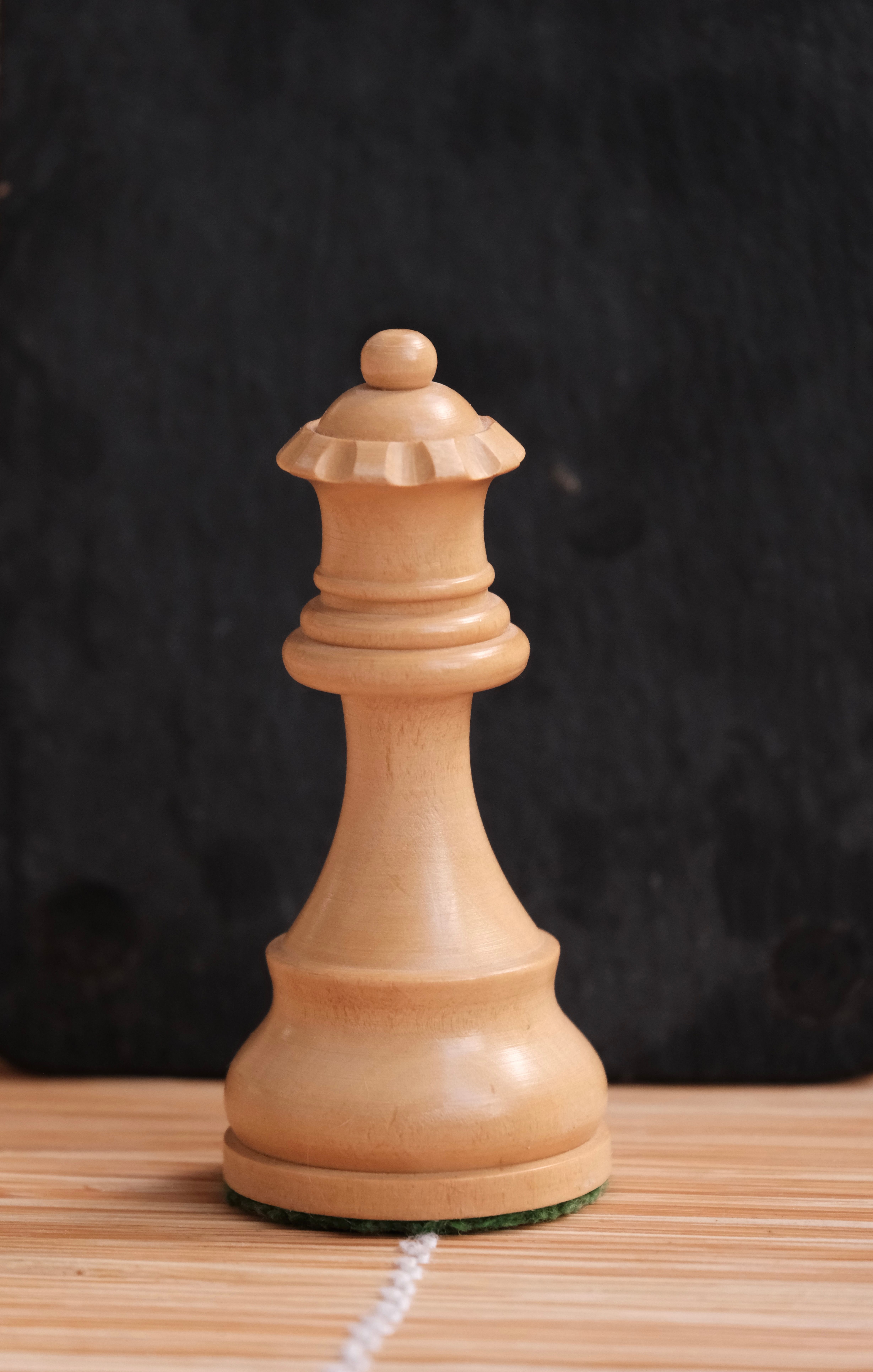 White Chess Queen Piece on Wooden Surface · Free Stock Photo