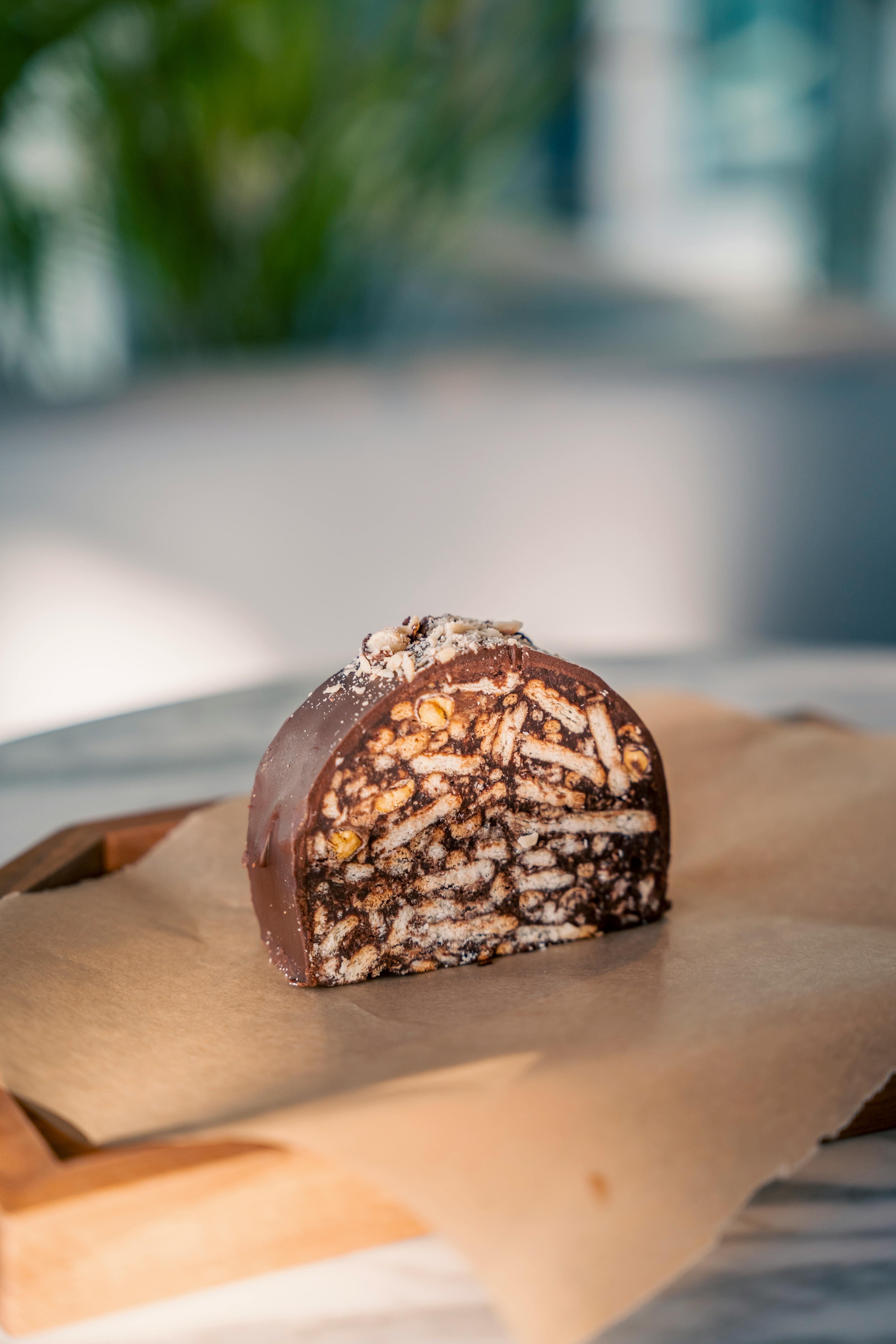 Delicious Chocolate Biscuit Slice on Wooden Crate · Free Stock Photo