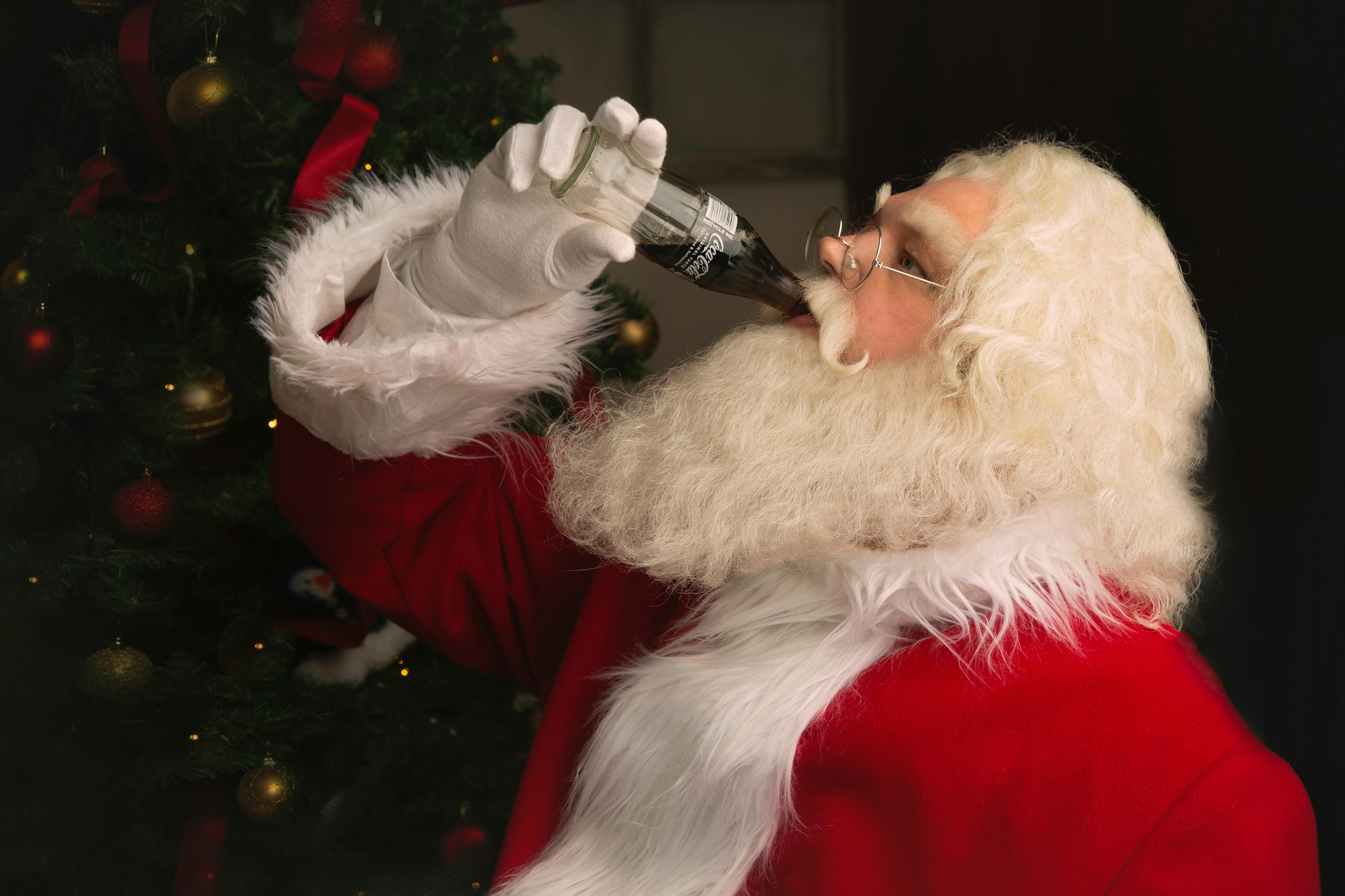 Santa Claus Enjoying a Christmas Beverage · Free Stock Photo