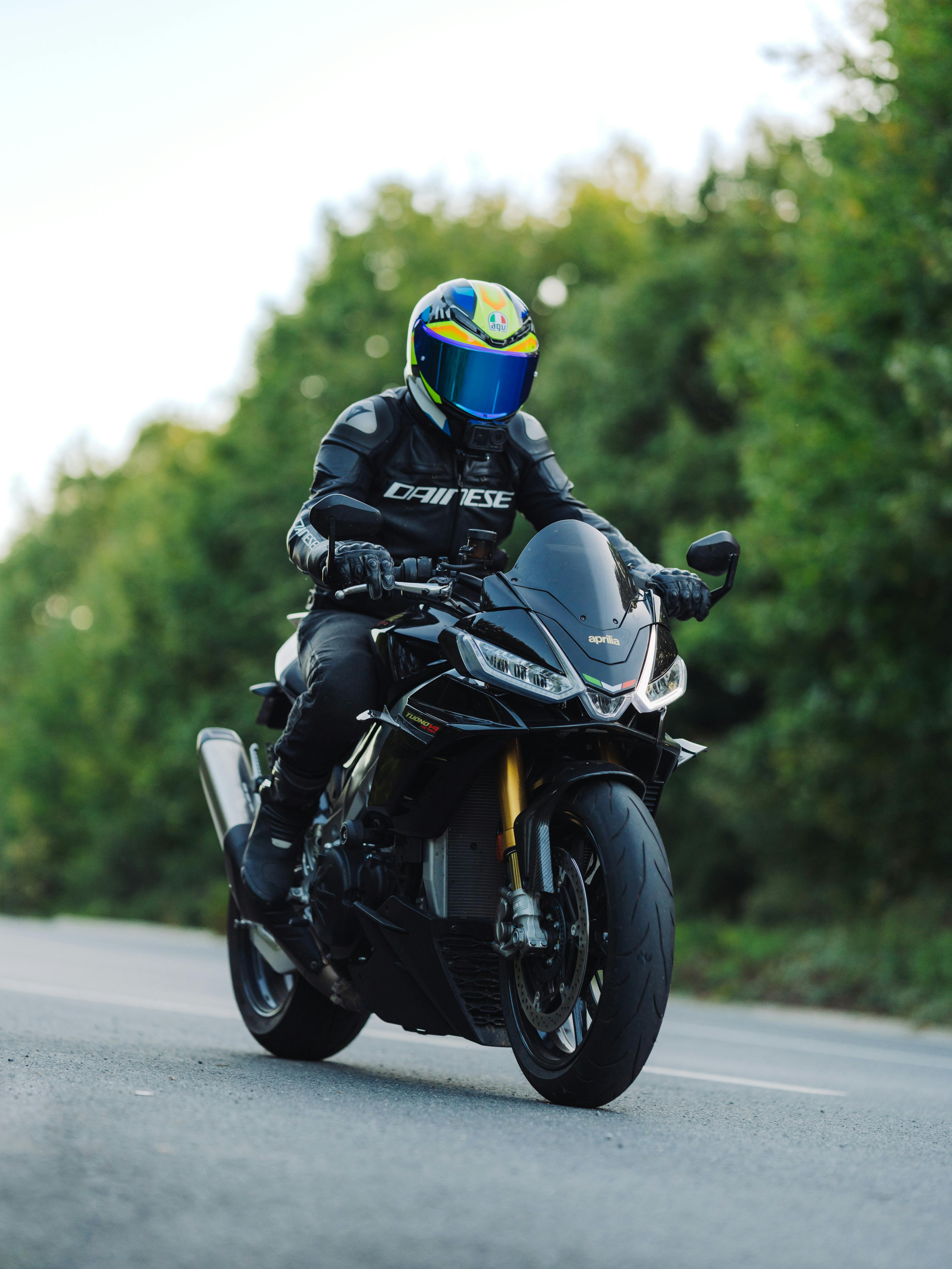 Motorcyclist on a Sportbike Riding Through Nature · Free Stock Photo