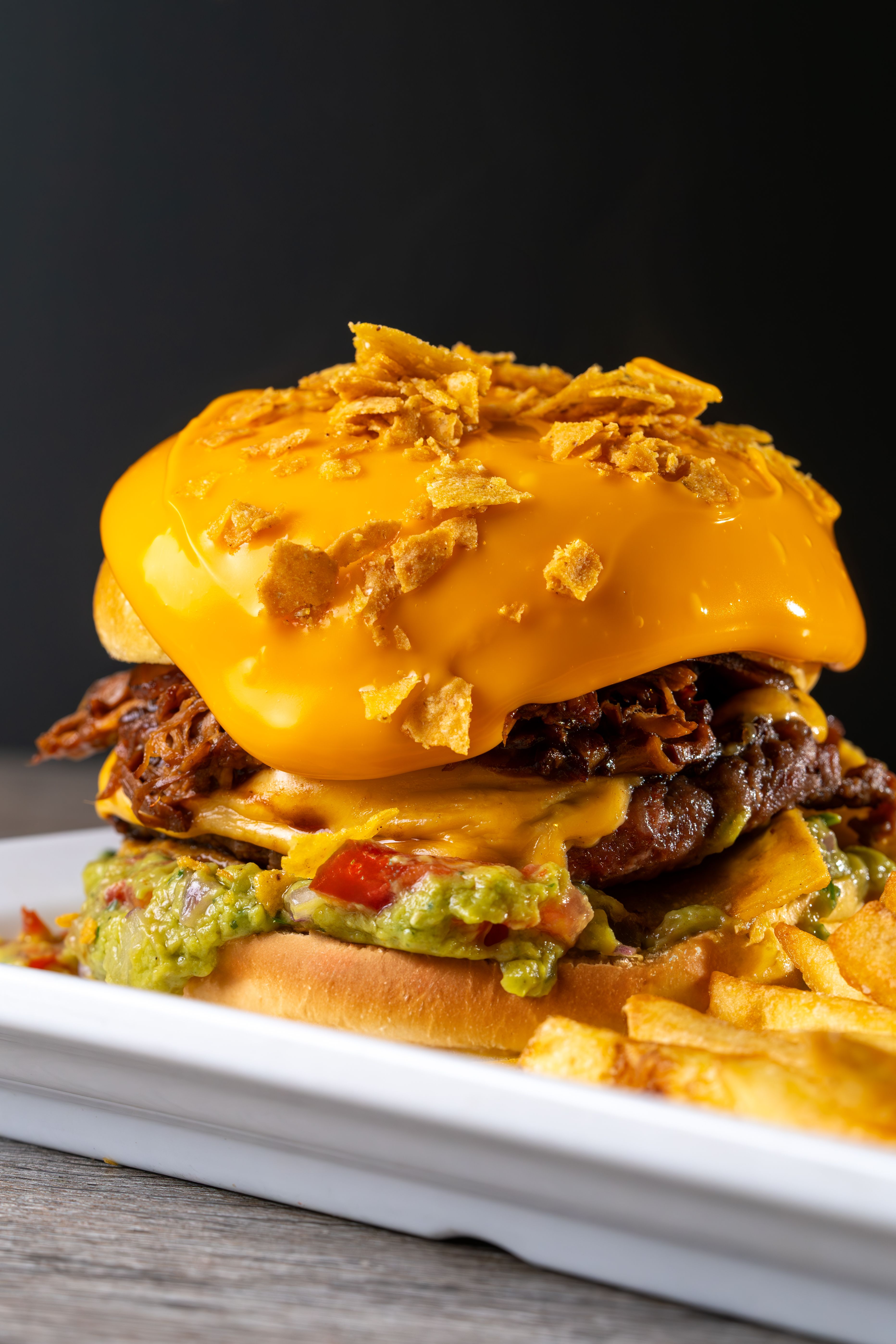 Delicious Gourmet Cheeseburger with Toppings · Free Stock Photo