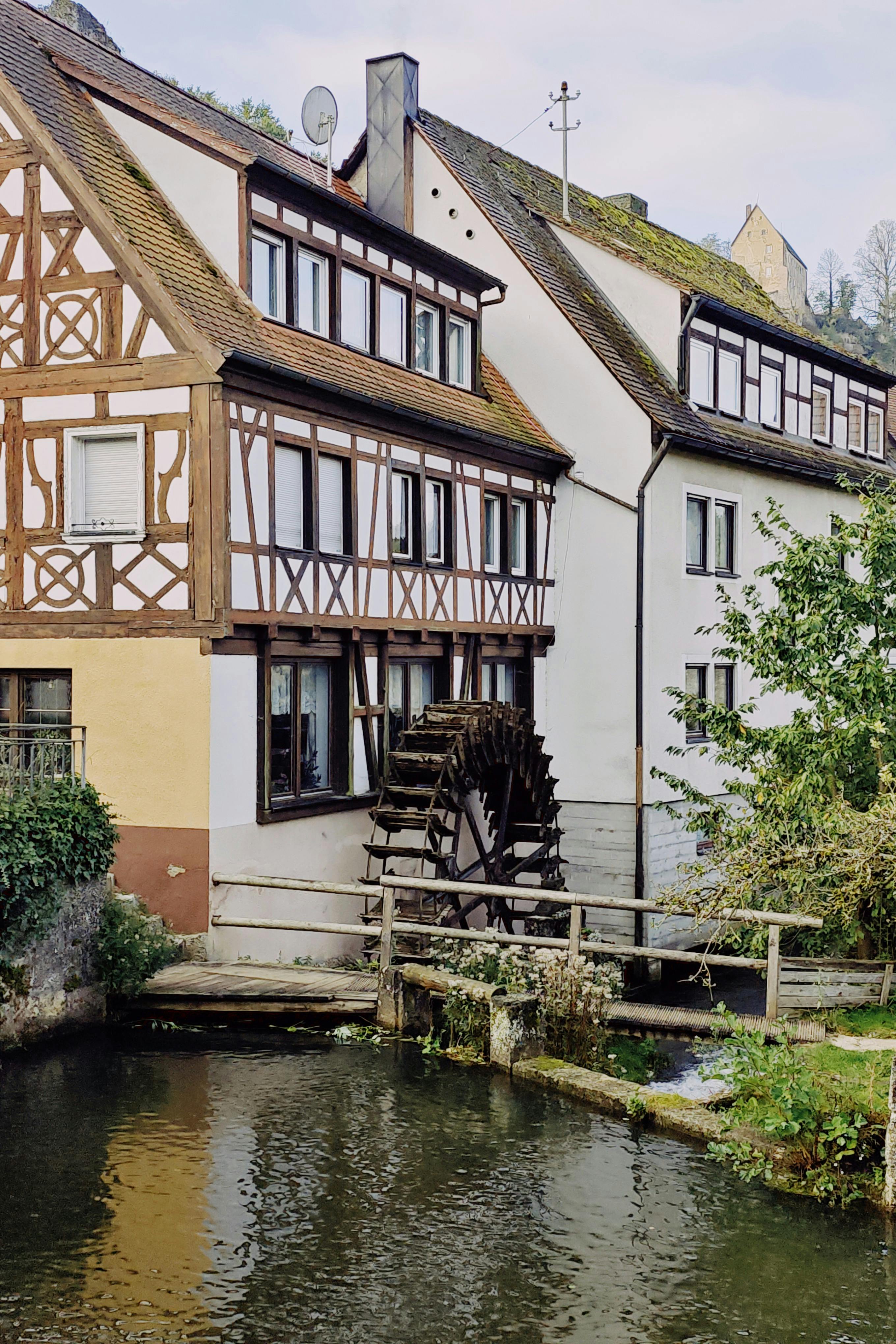 Traditional Waterwheel House by River · Free Stock Photo
