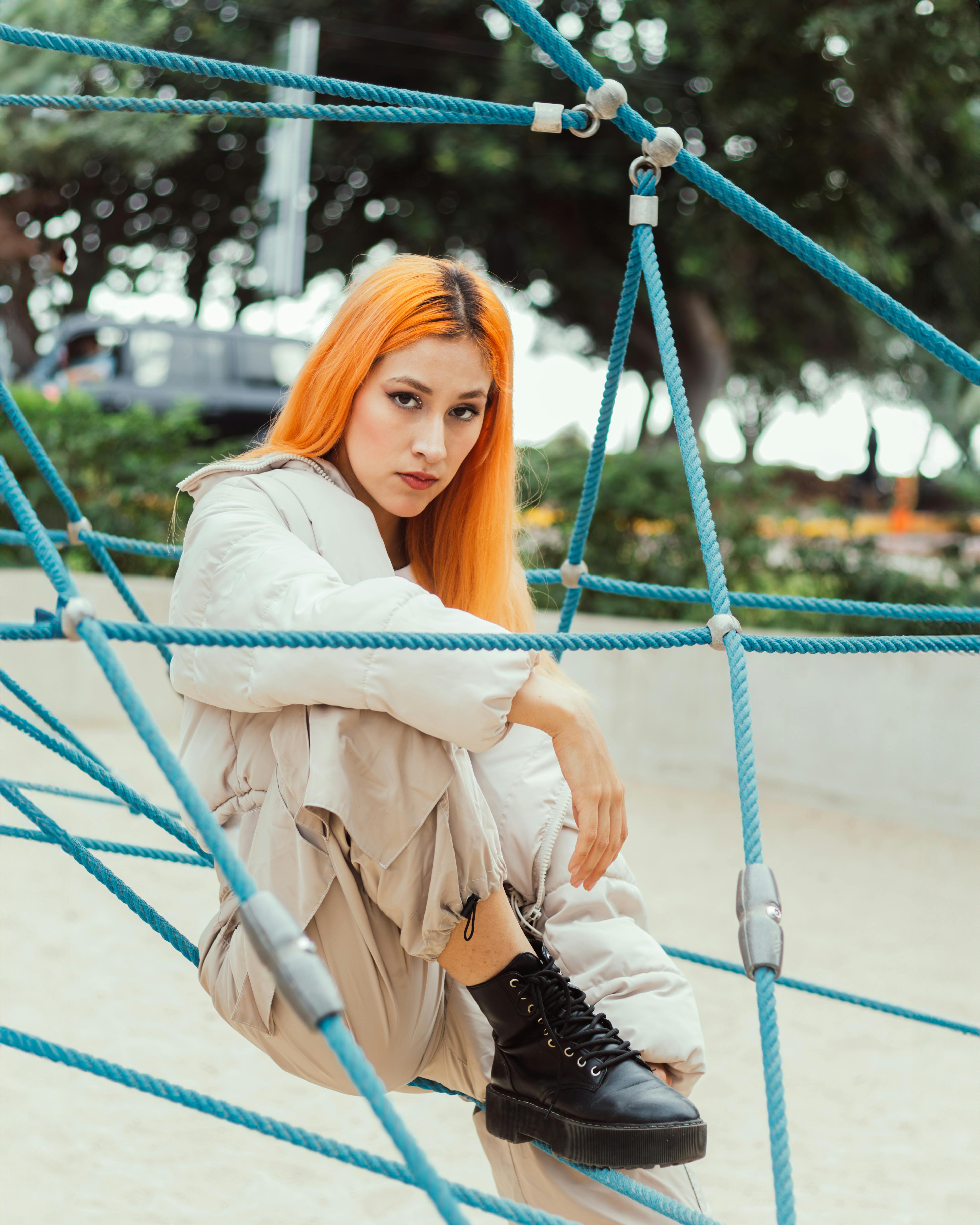 Young Woman on Urban Rope Structure Outdoors · Free Stock Photo