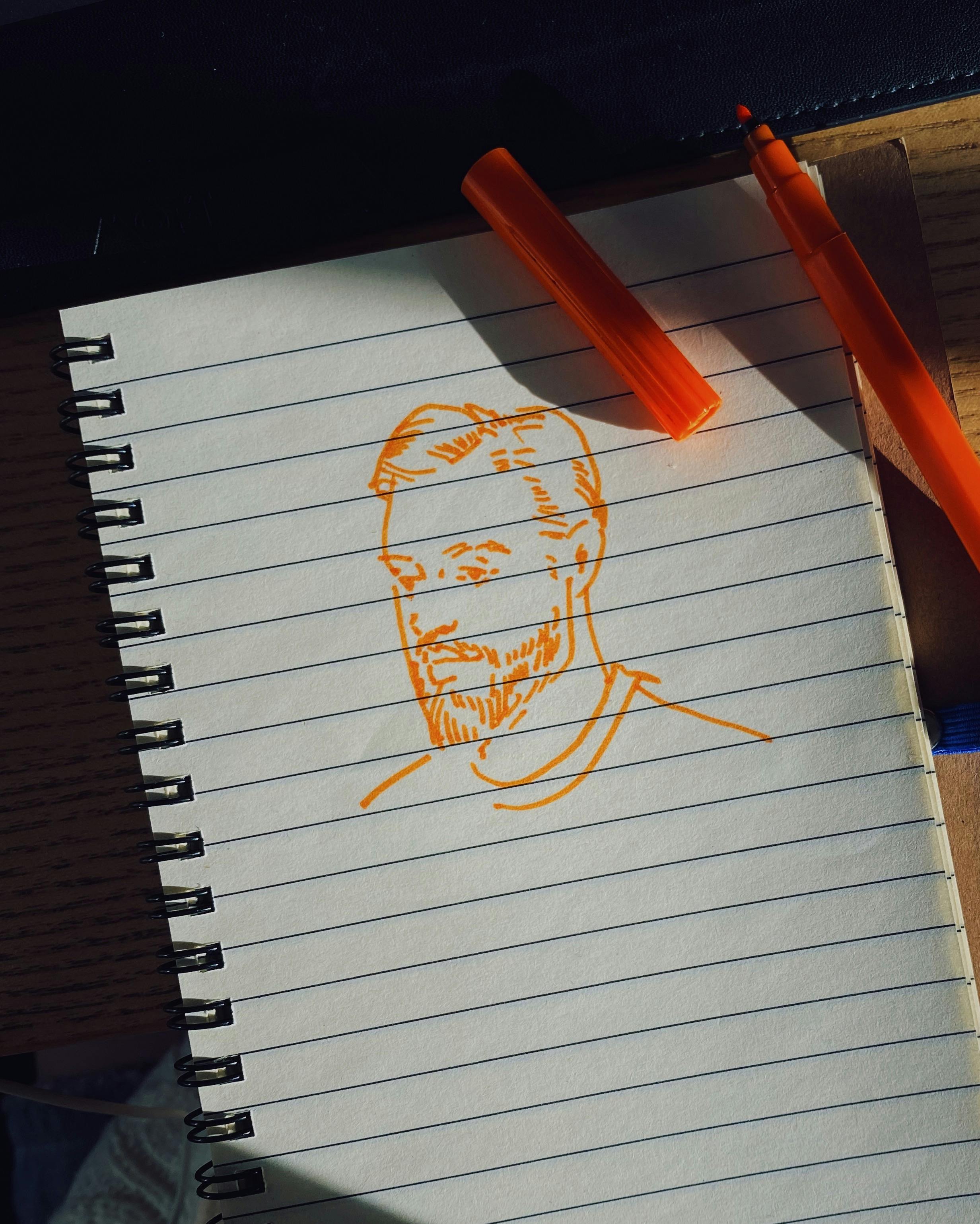 Person Holding White Paper on a Notebook · Free Stock Photo