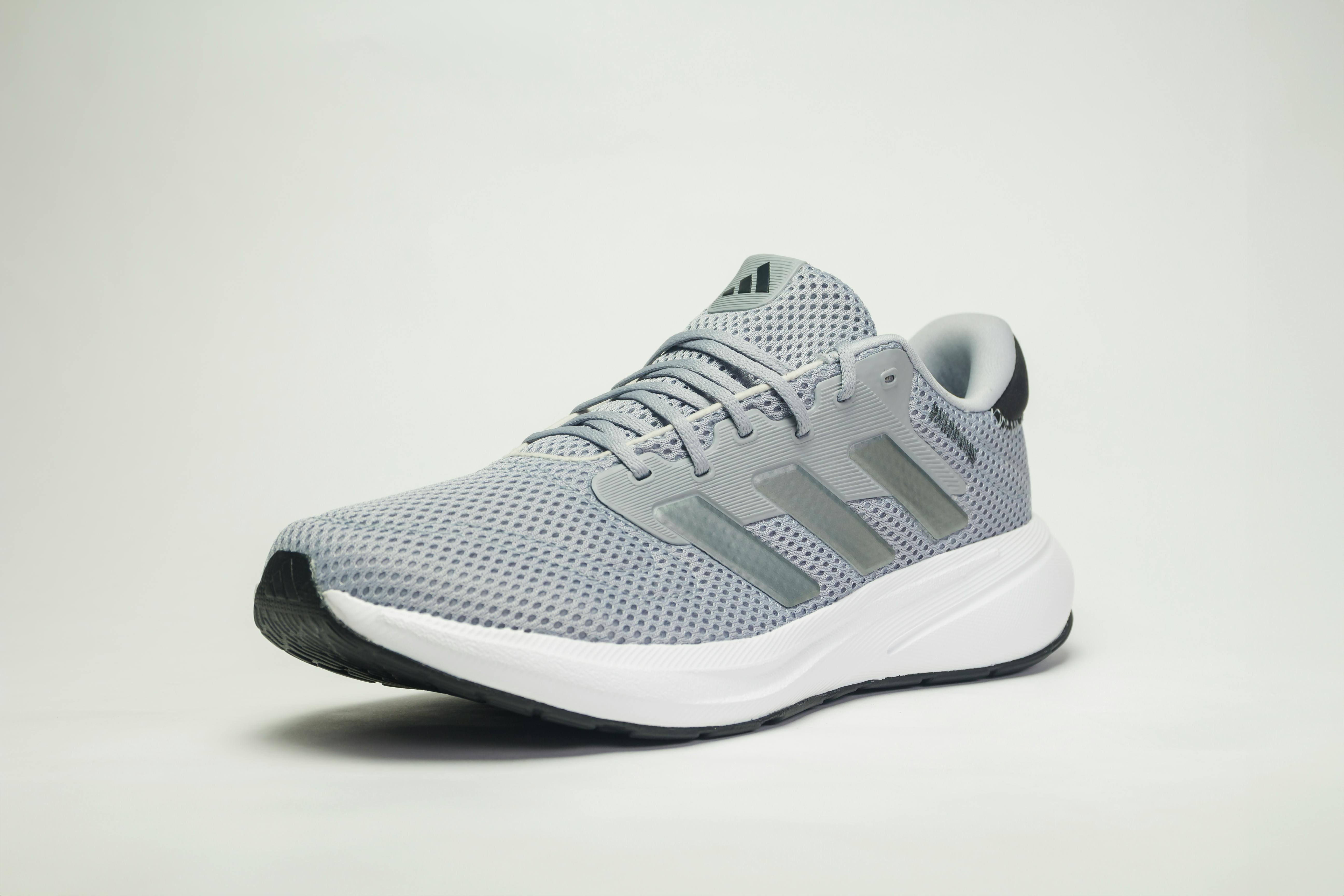 Stylish Adidas Gray Running Shoe on White Background · Free Stock Photo