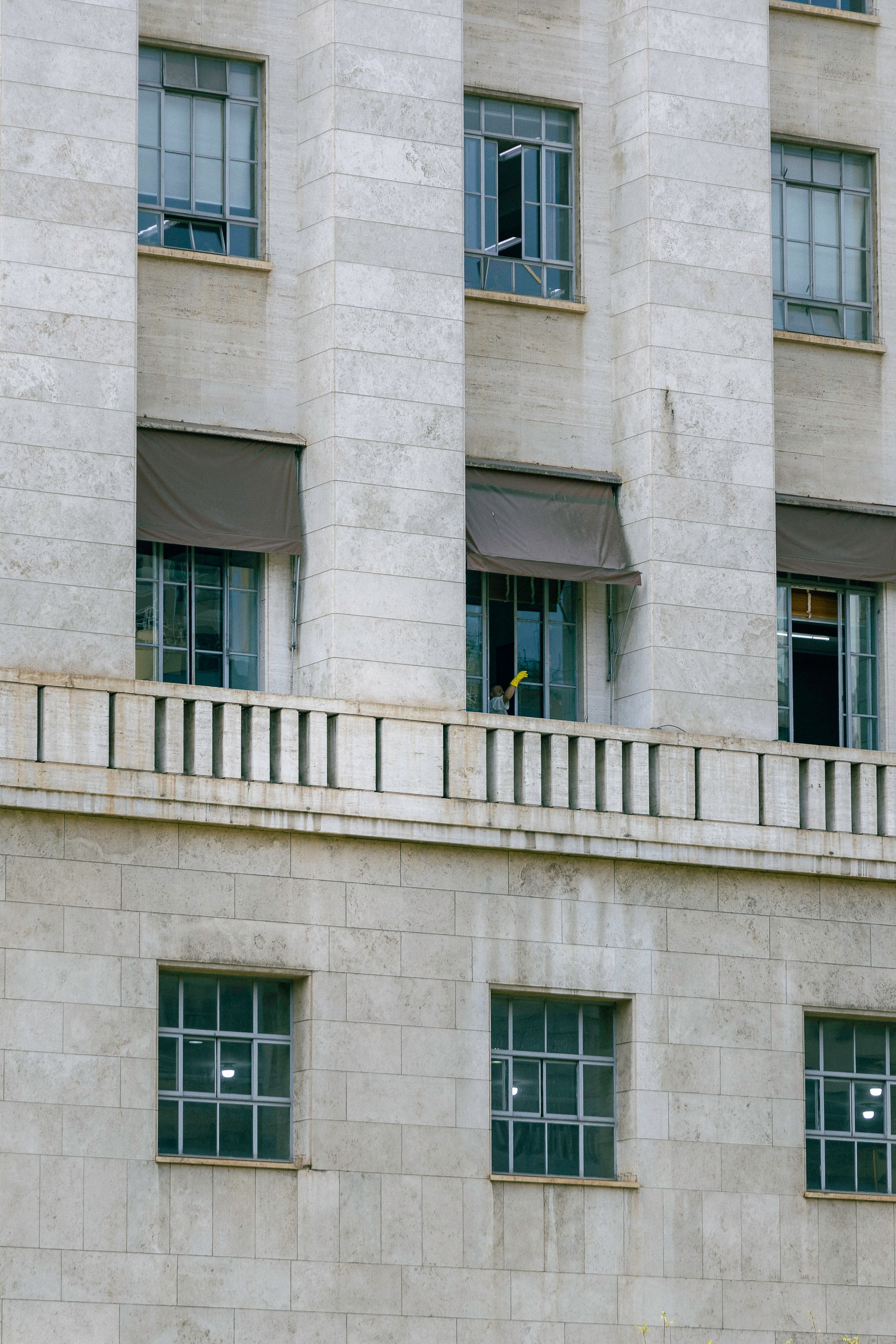 Classic Building Facade with Open Windows · Free Stock Photo