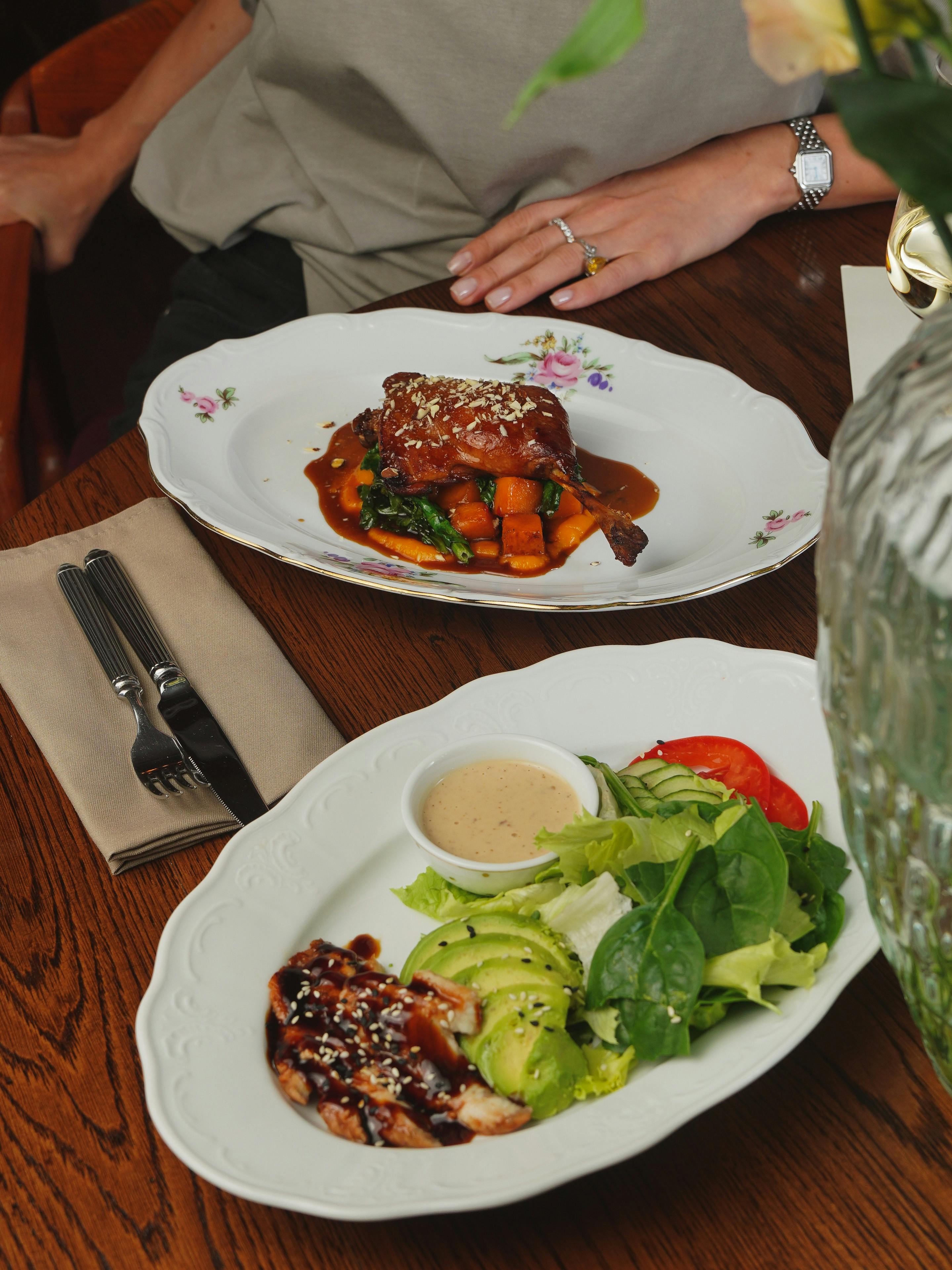 Delicious Fine Dining Dishes on Elegant Table Setting · Free Stock Photo