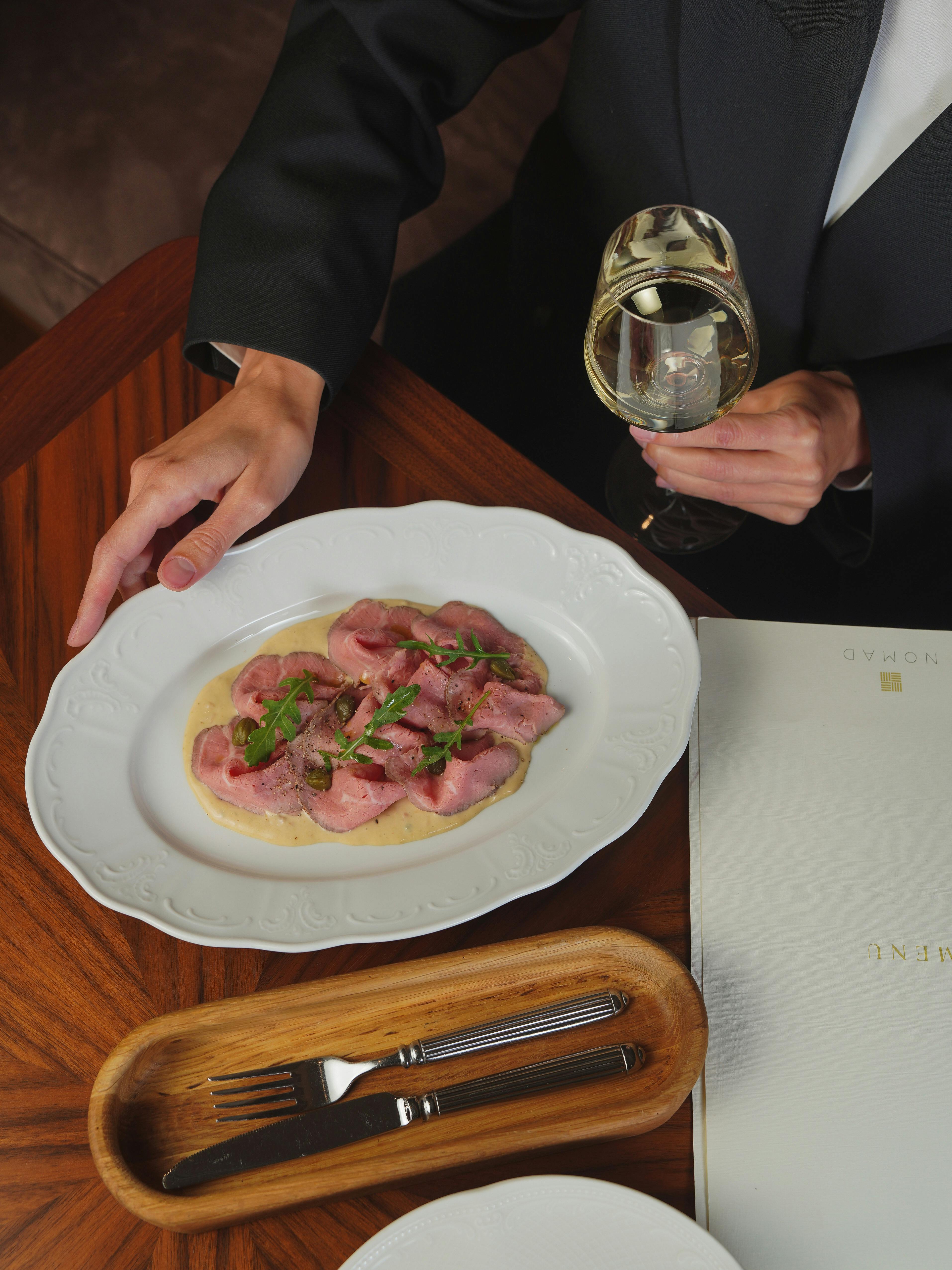 Elegant Dining with Sliced Roast Beef Dish · Free Stock Photo