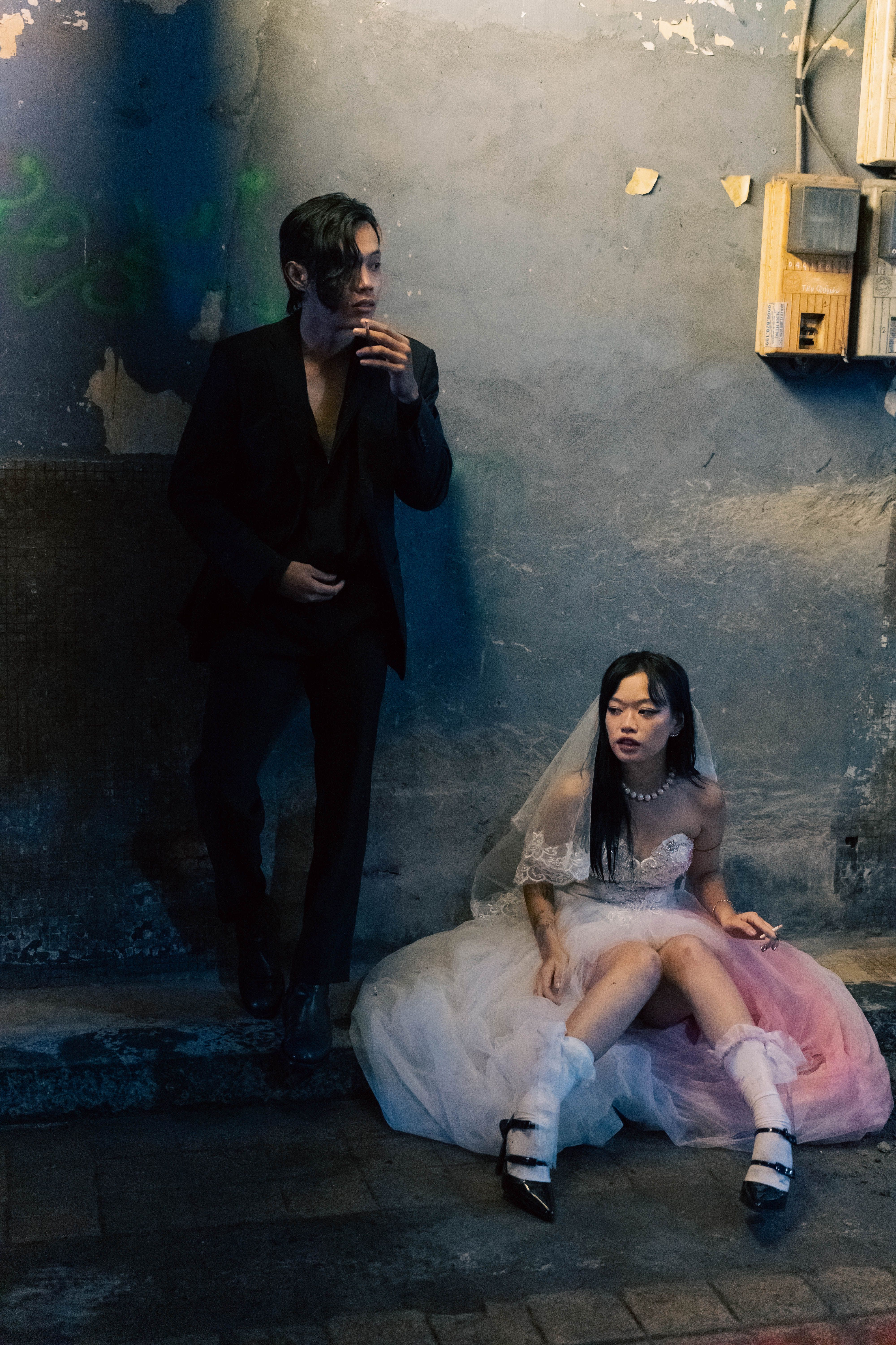 Dramatic Urban Wedding Scene in Dimly Lit Alleyway · Free Stock Photo
