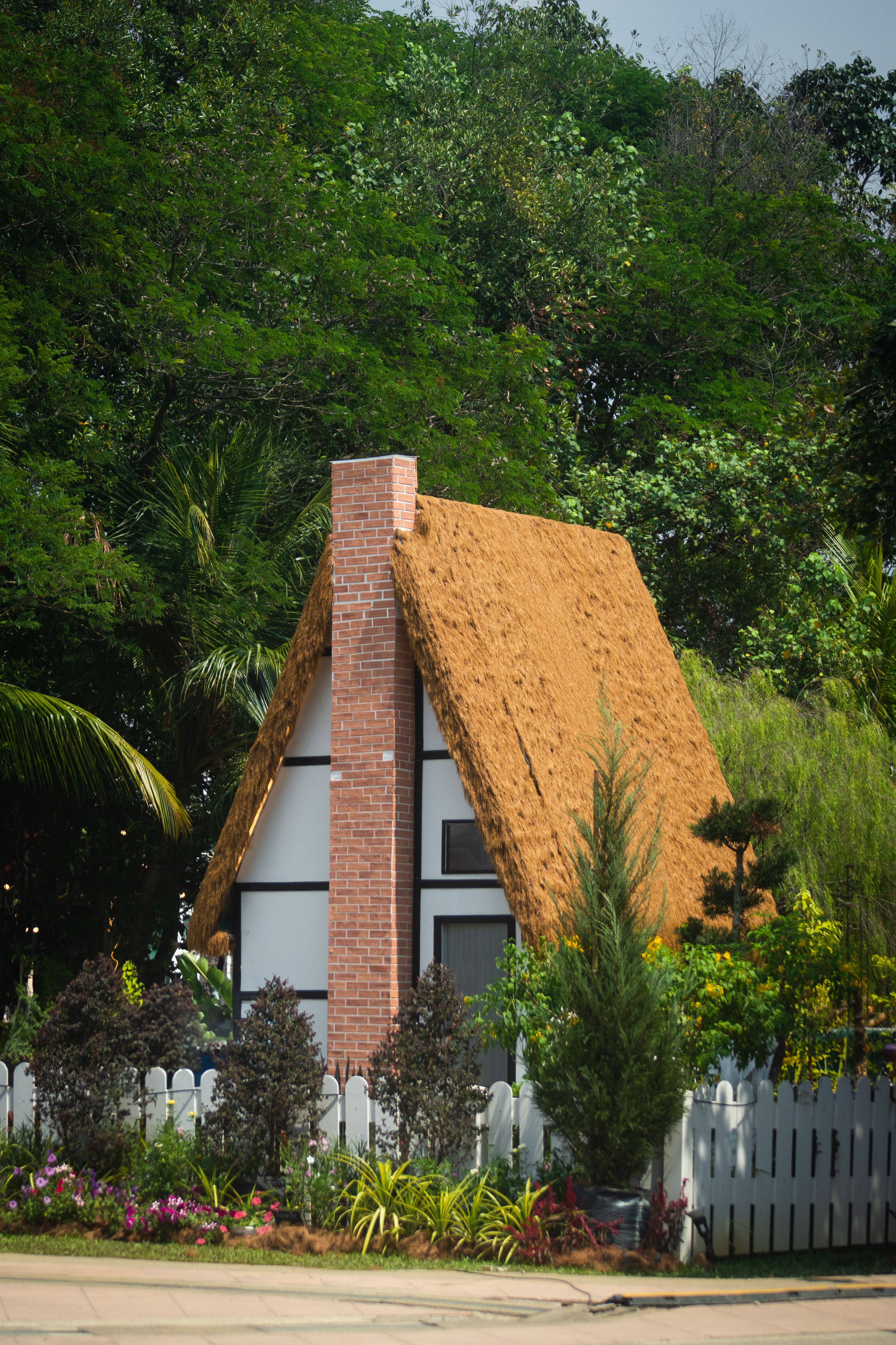 Charming A-Frame House with Thatched Roof in Forest · Free Stock Photo