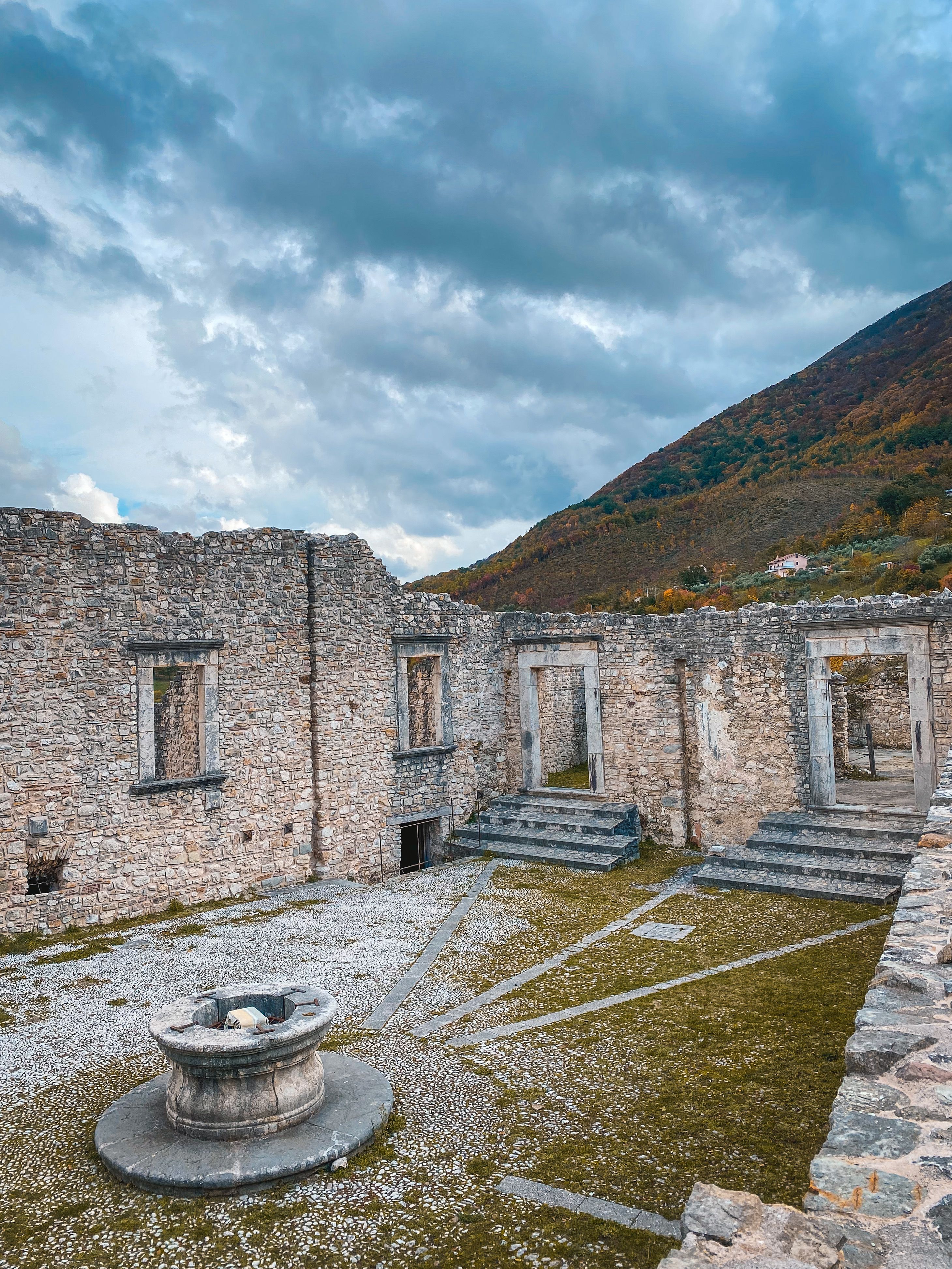 Ancient Italian Castle Ruins Amidst Scenic Mountains · Free Stock Photo