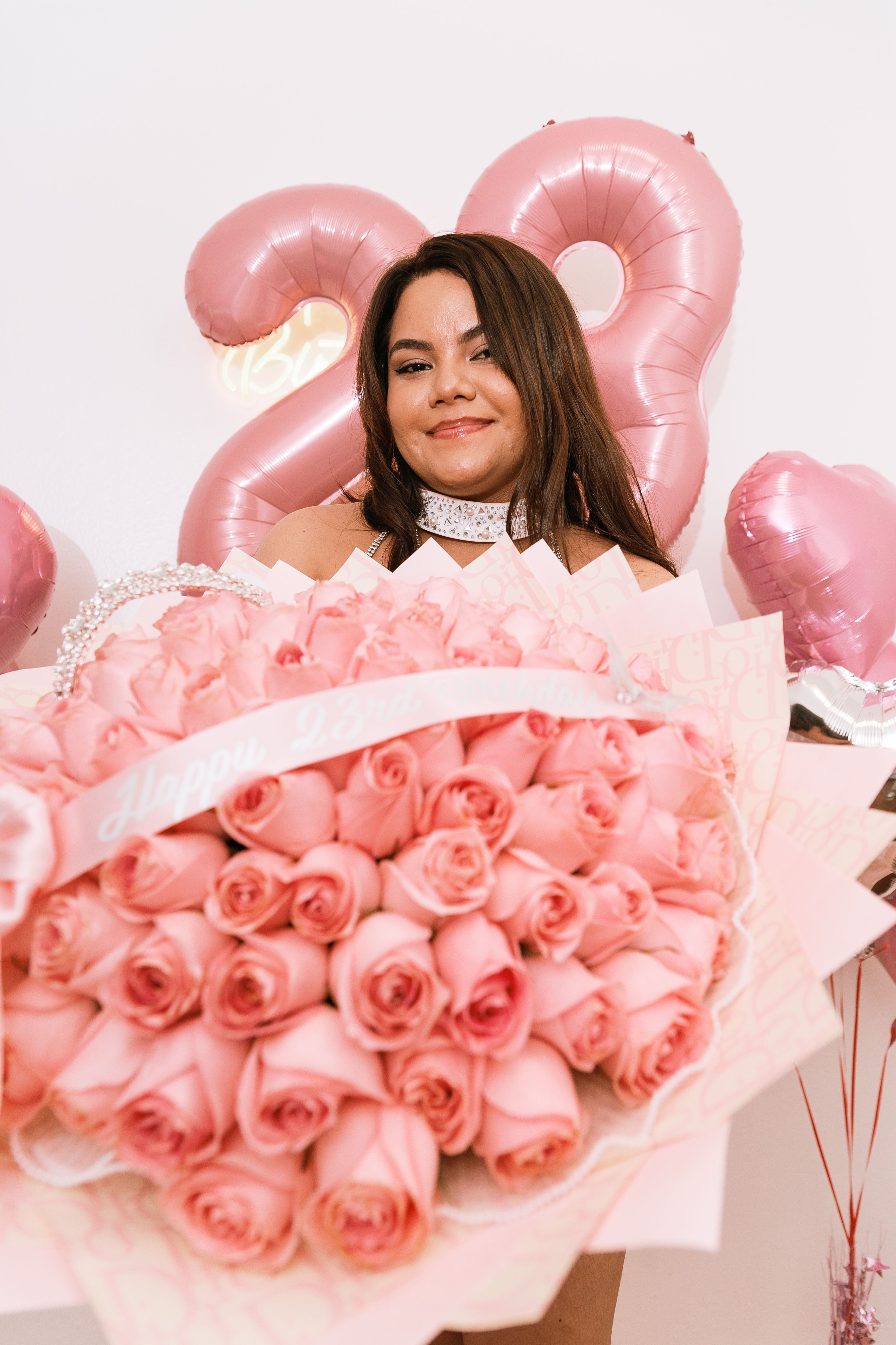 Woman Celebrating 28th Birthday with Pink Roses · Free Stock Photo