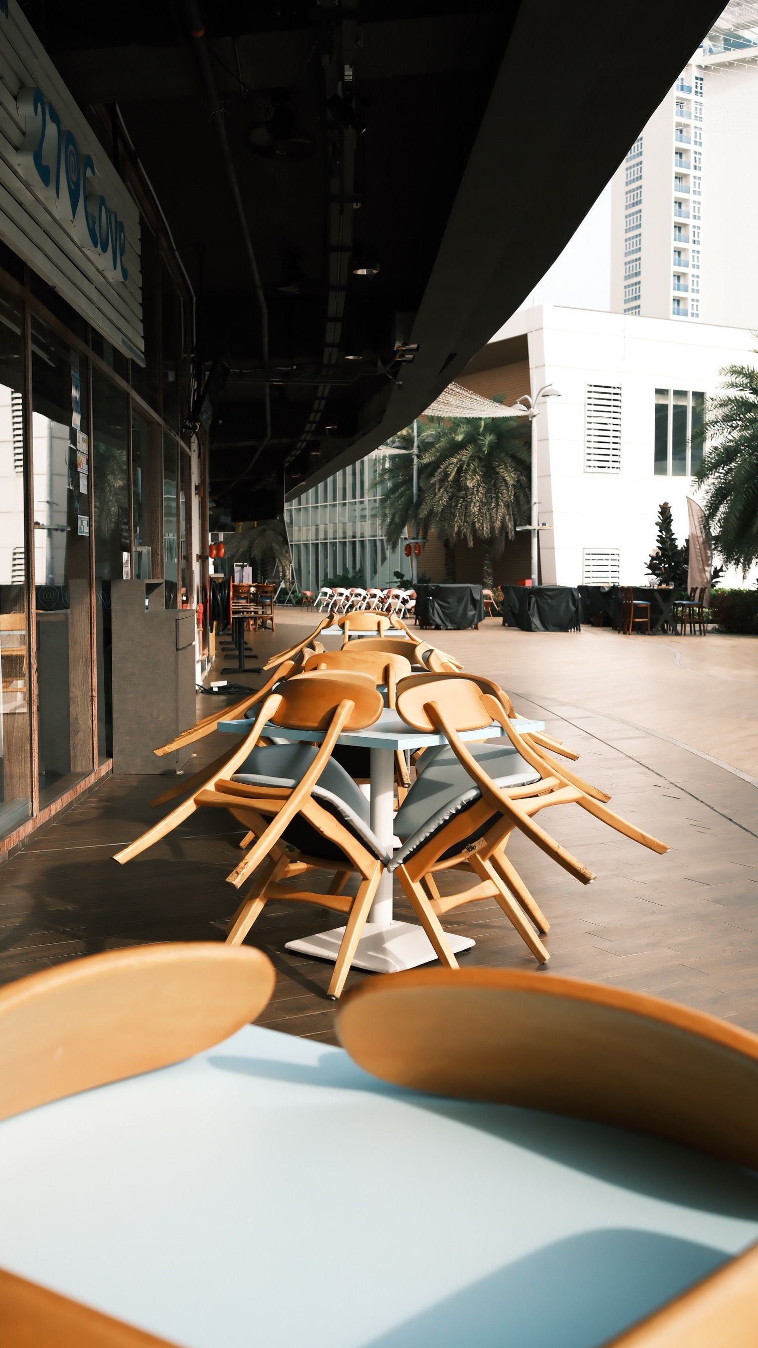 Outdoor Restaurant Seating with Wooden Chairs · Free Stock Photo