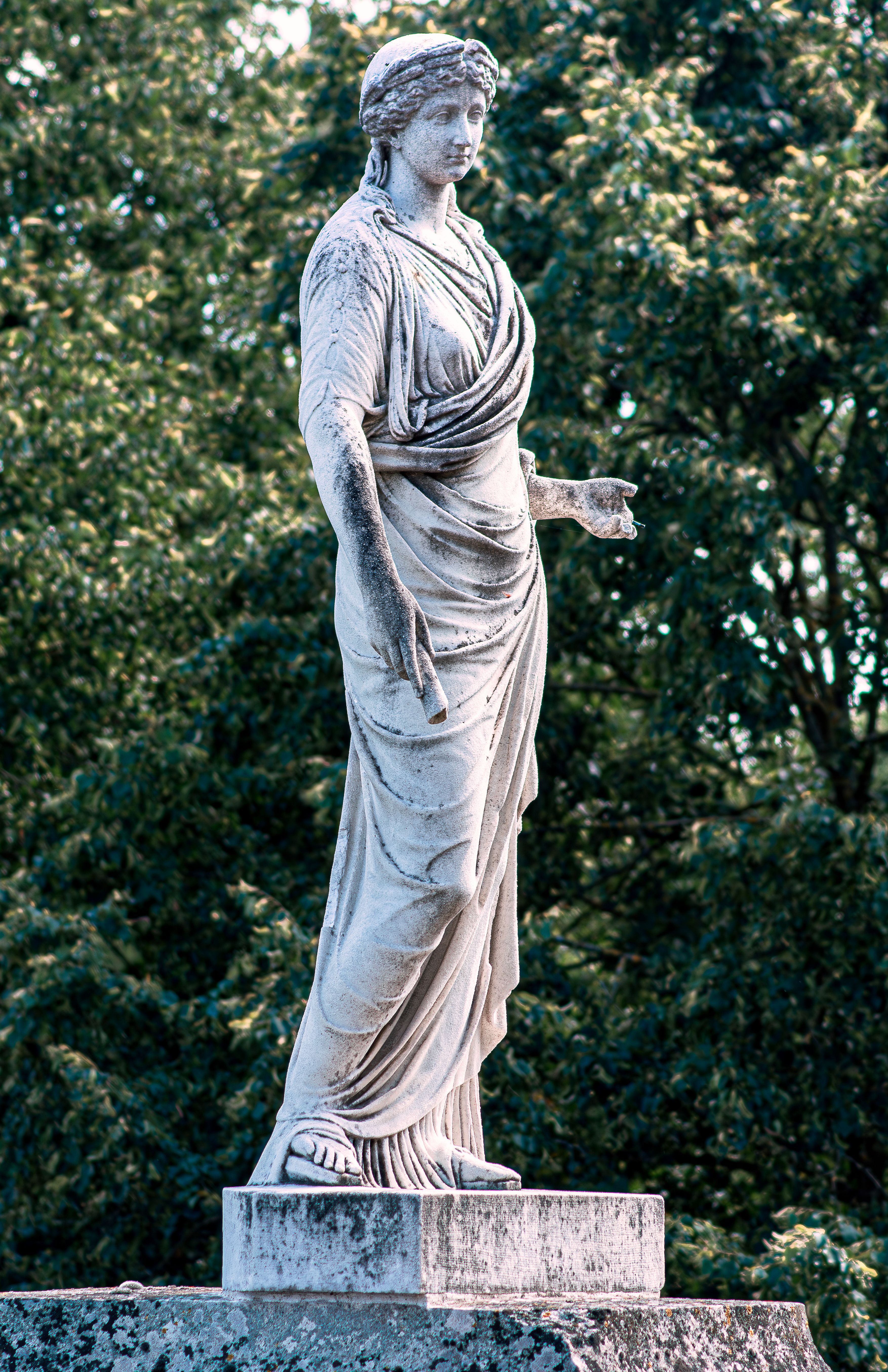 Classical Statue in Lush Garden Setting · Free Stock Photo