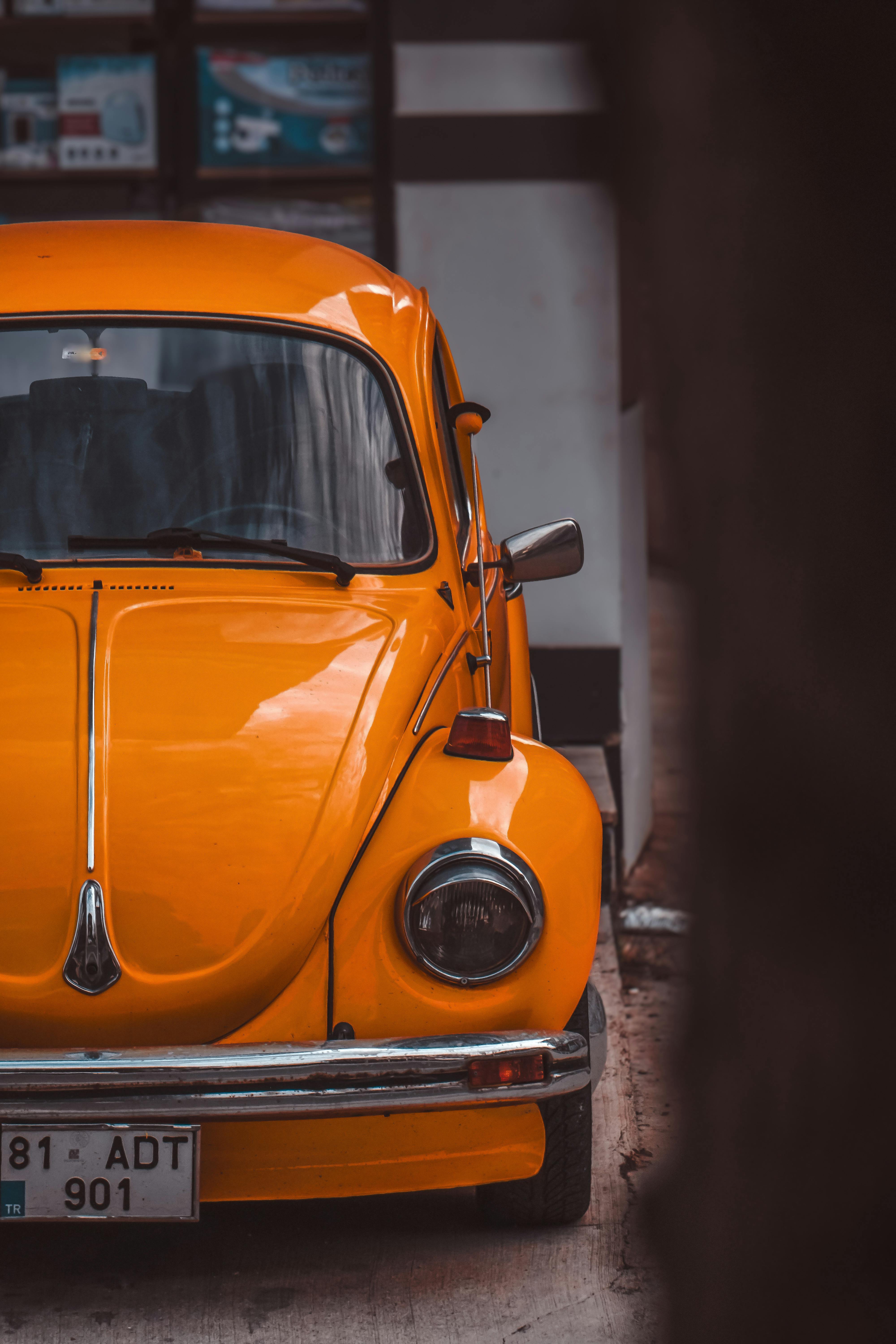 Classic Yellow Vintage Car in Urban Setting · Free Stock Photo