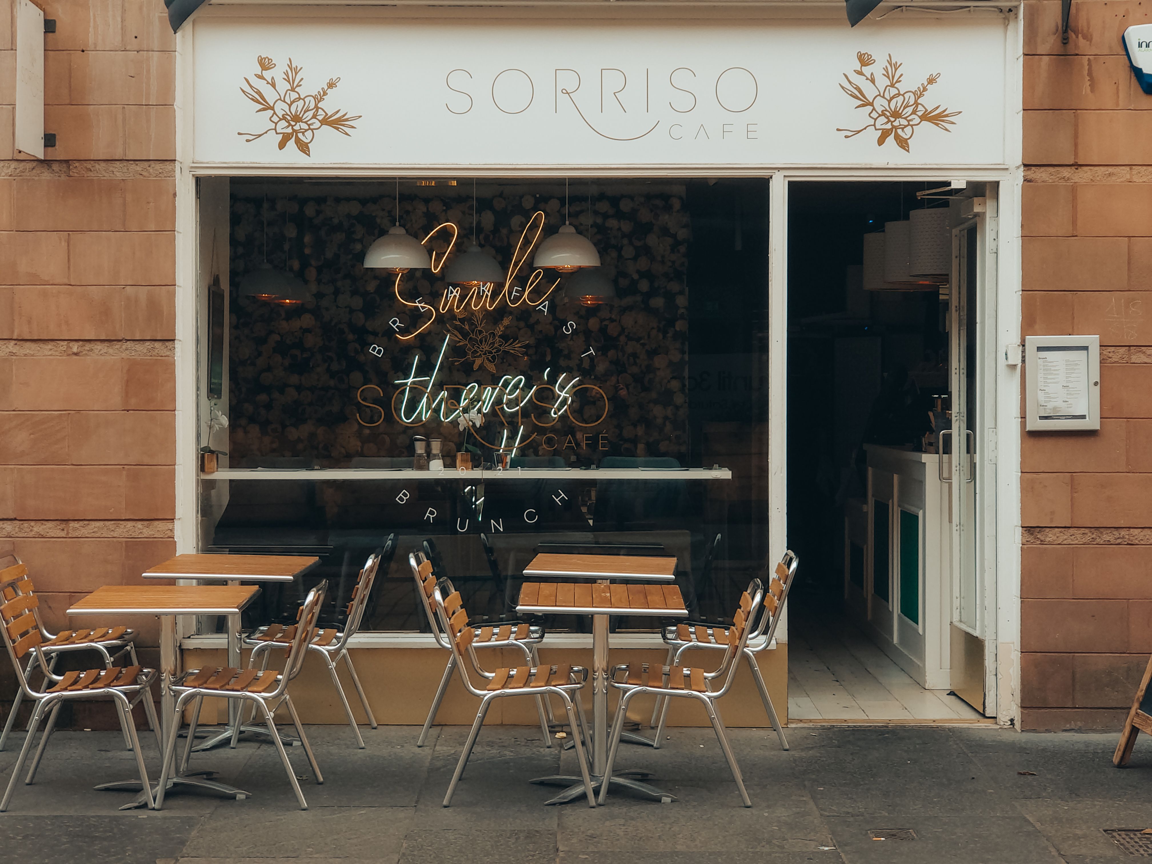 Charming Café Front in Urban Setting · Free Stock Photo
