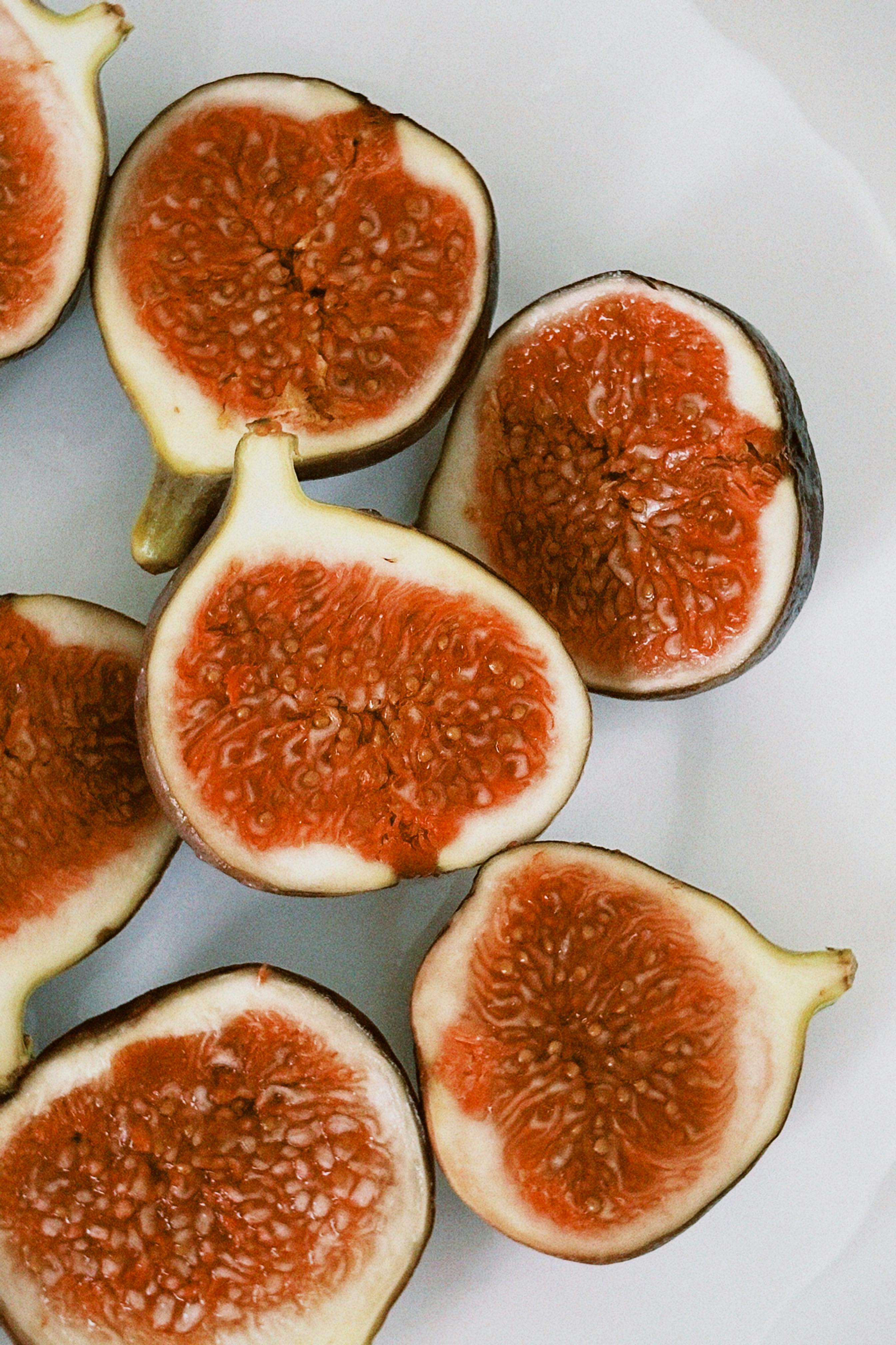 Close-up of Freshly Sliced Figs on a Plate · Free Stock Photo