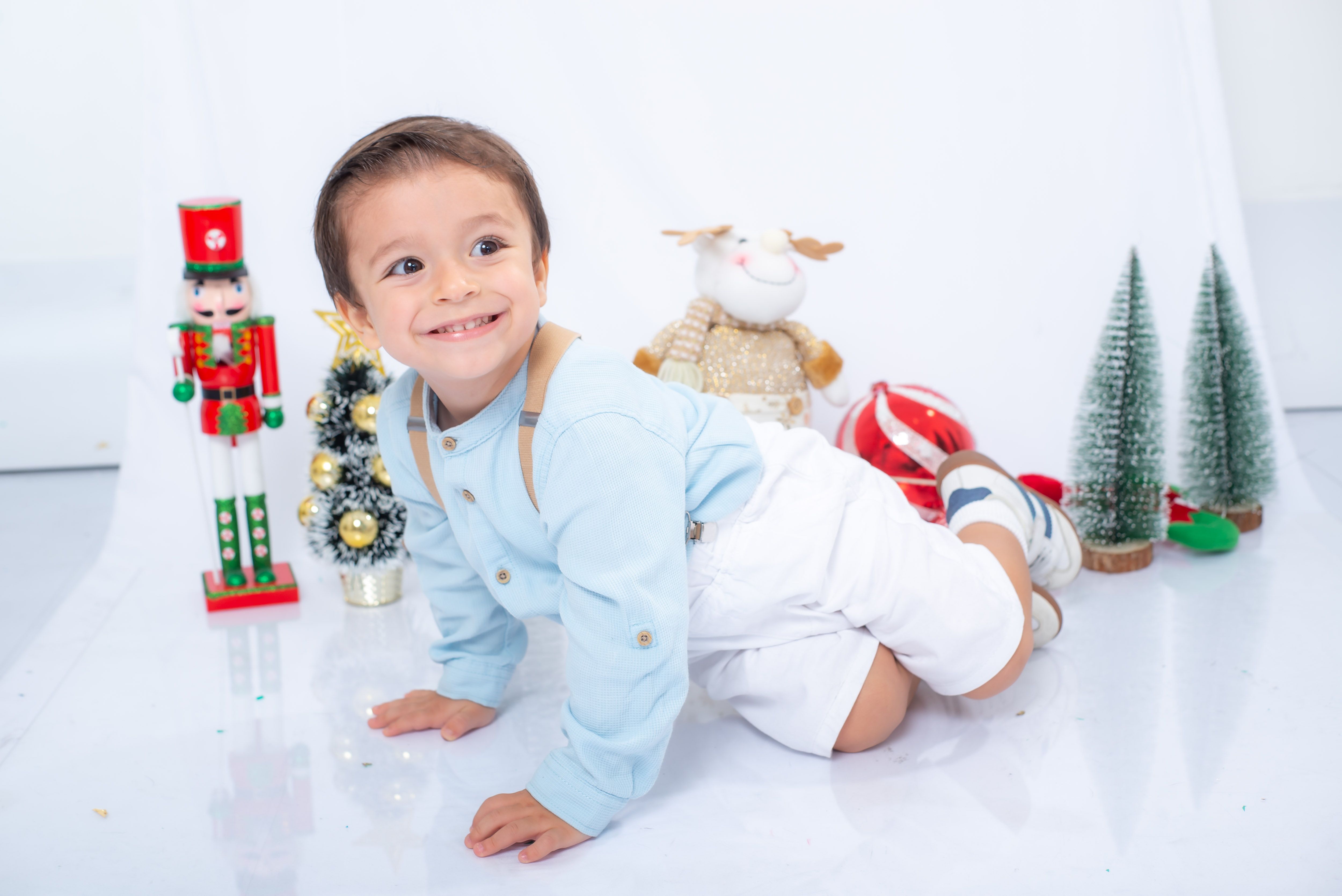 Adorable Child with Christmas Decorations · Free Stock Photo