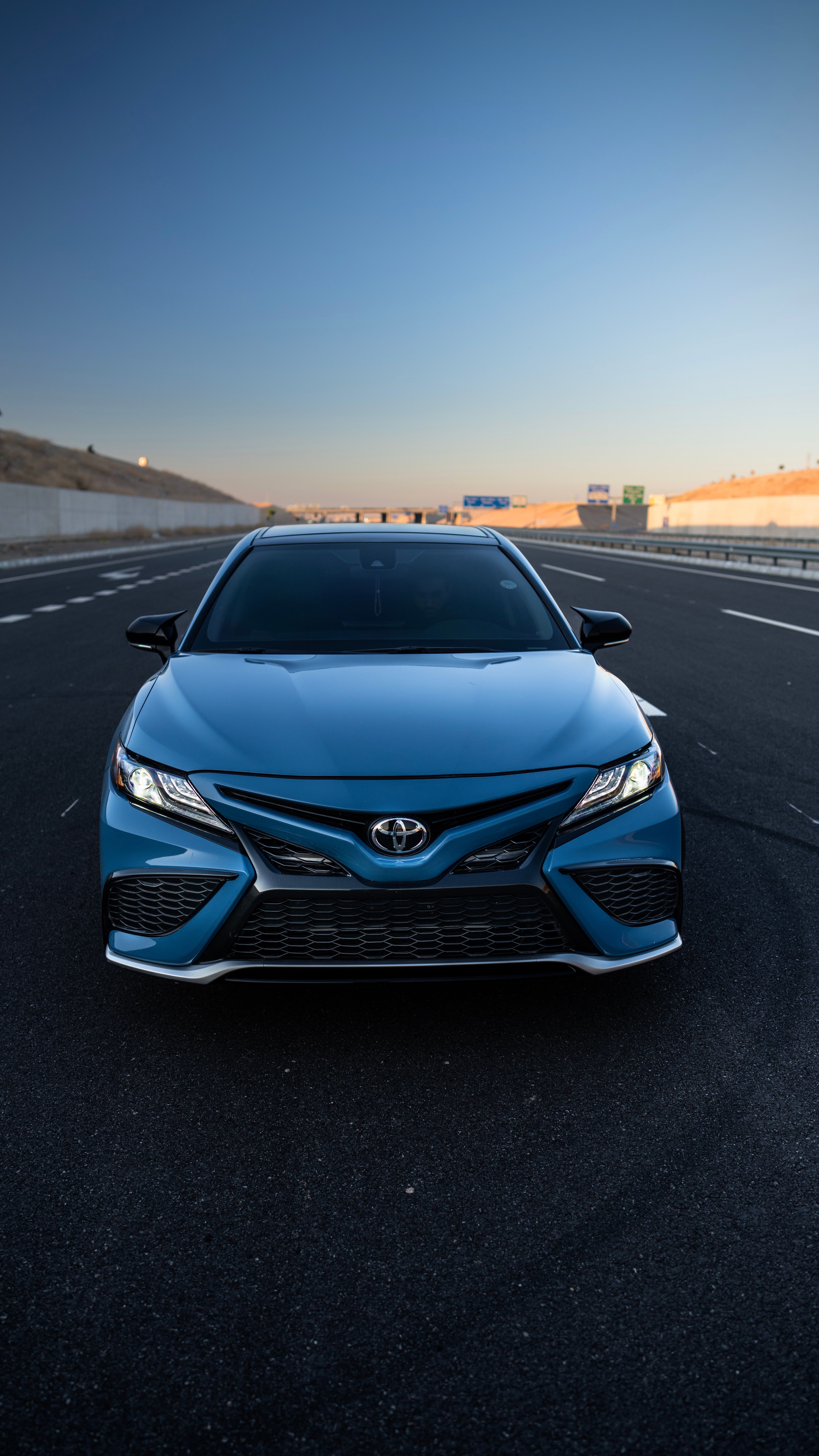 Sleek Blue Toyota Sedan on Urban Highway · Free Stock Photo