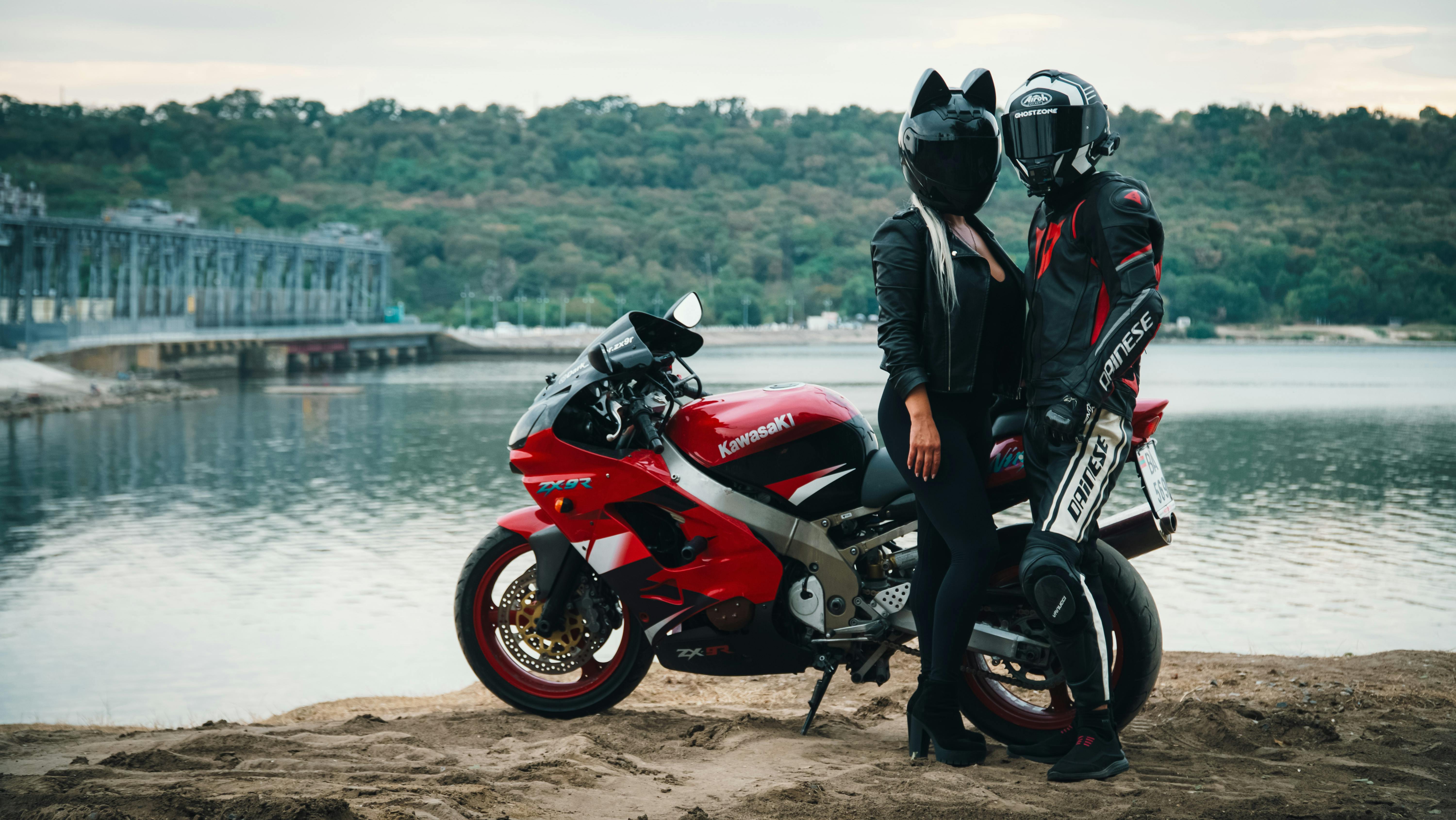 Bikers Posing with Red Motorcycle by River · Free Stock Photo