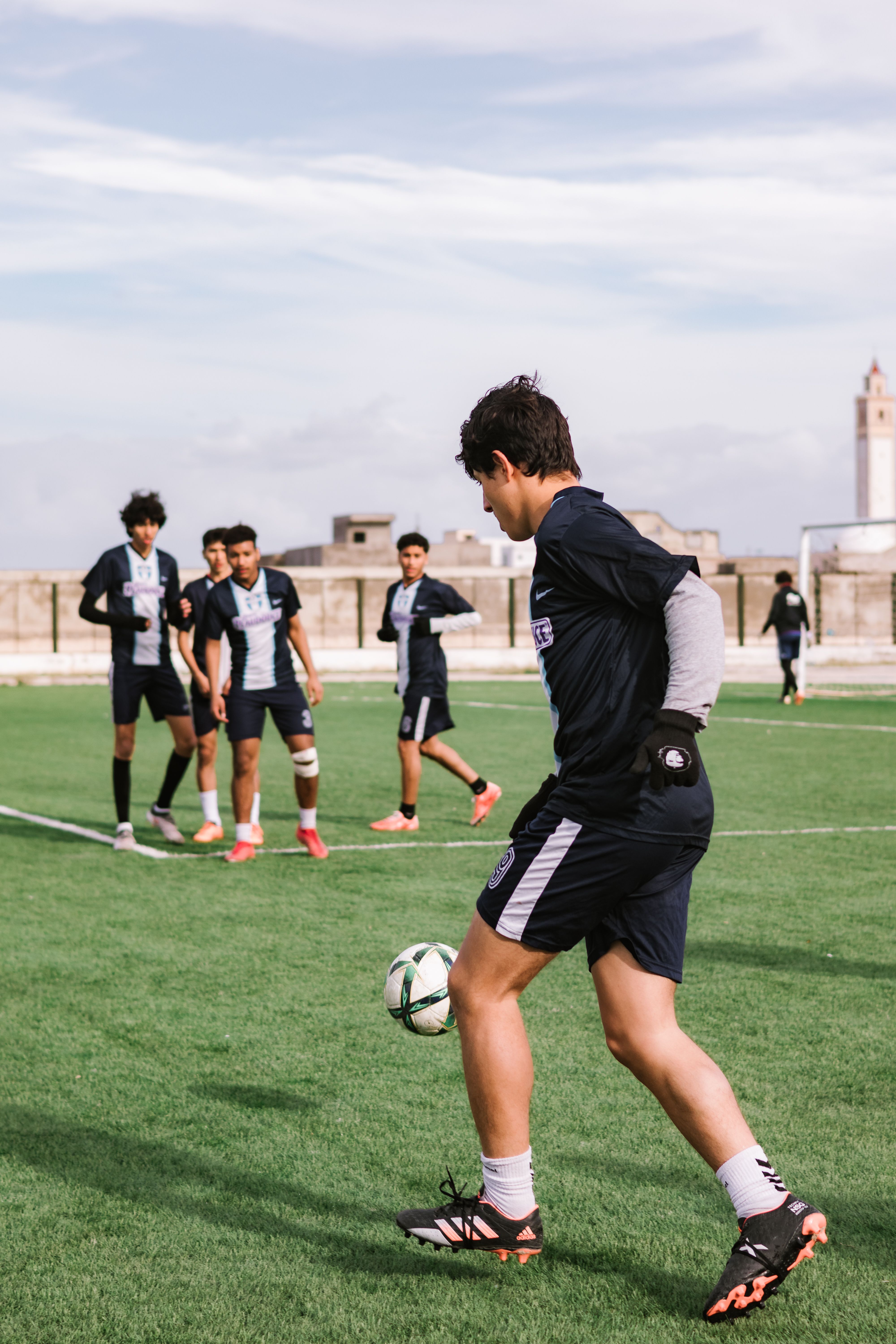 Teen Soccer Players Practicing Outdoors on Field · Free Stock Photo