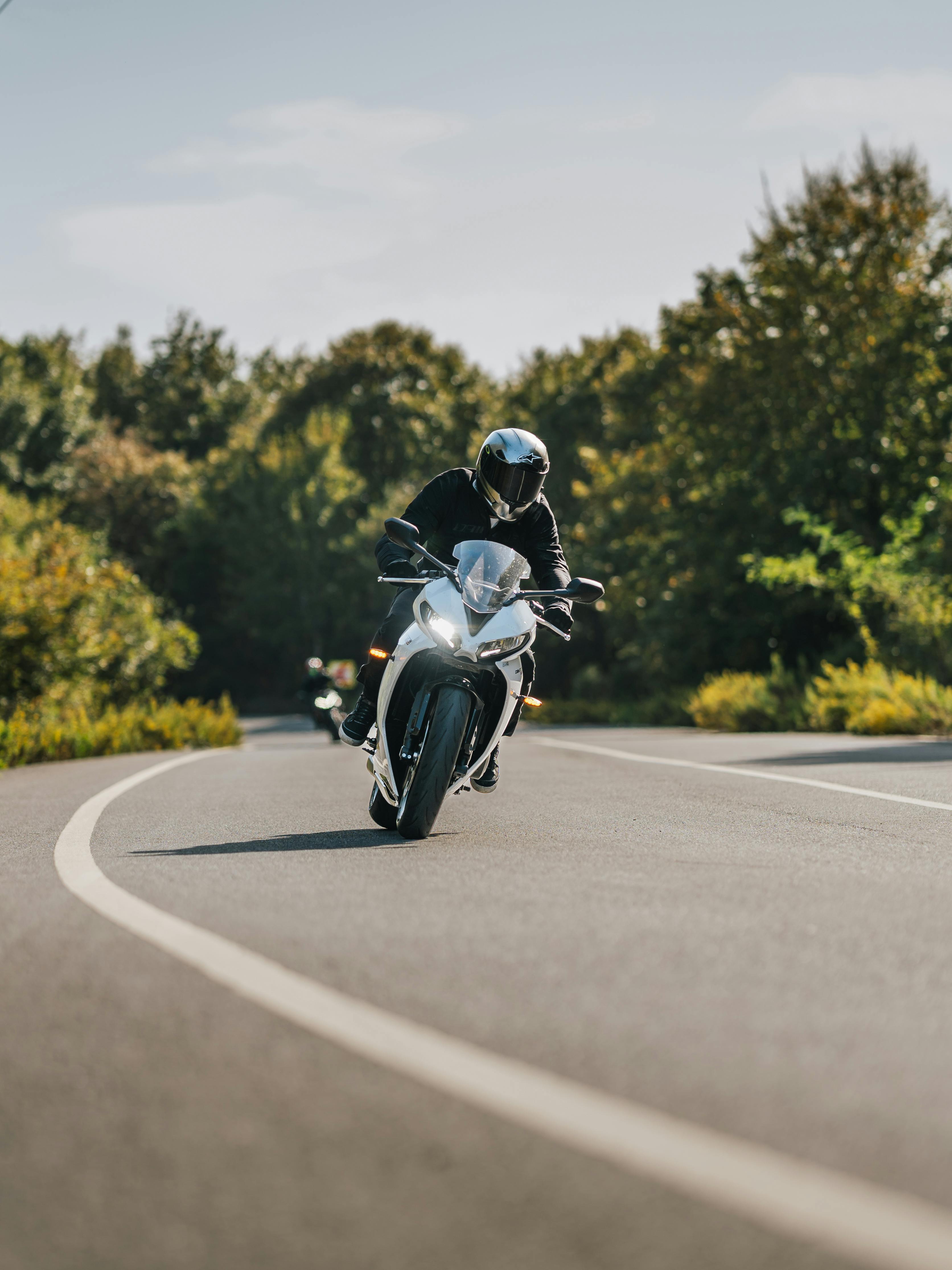 Person Riding Motorcycle during Golden Hour · Free Stock Photo