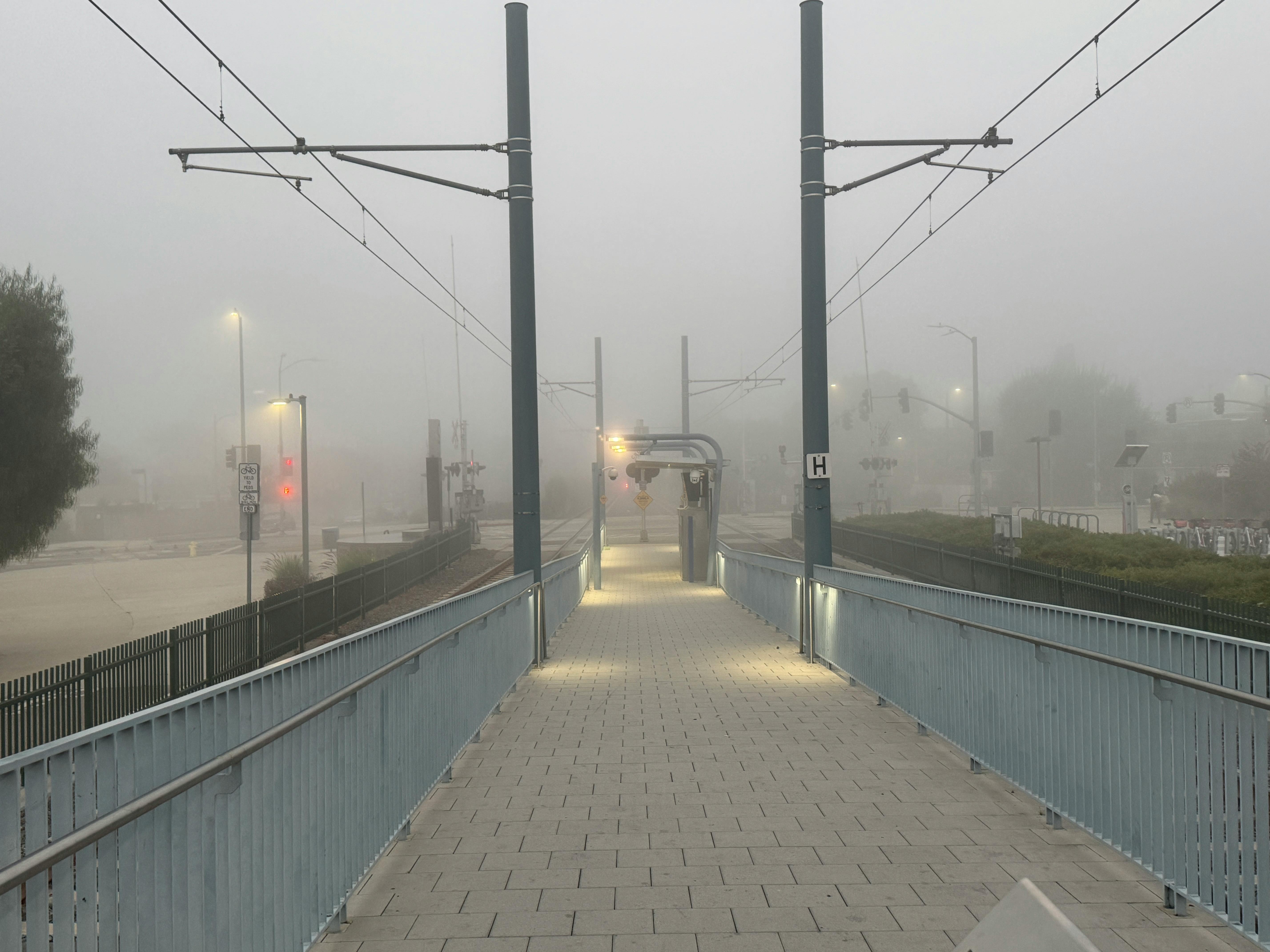 Foggy Urban Light Rail Platform at Dawn · Free Stock Photo