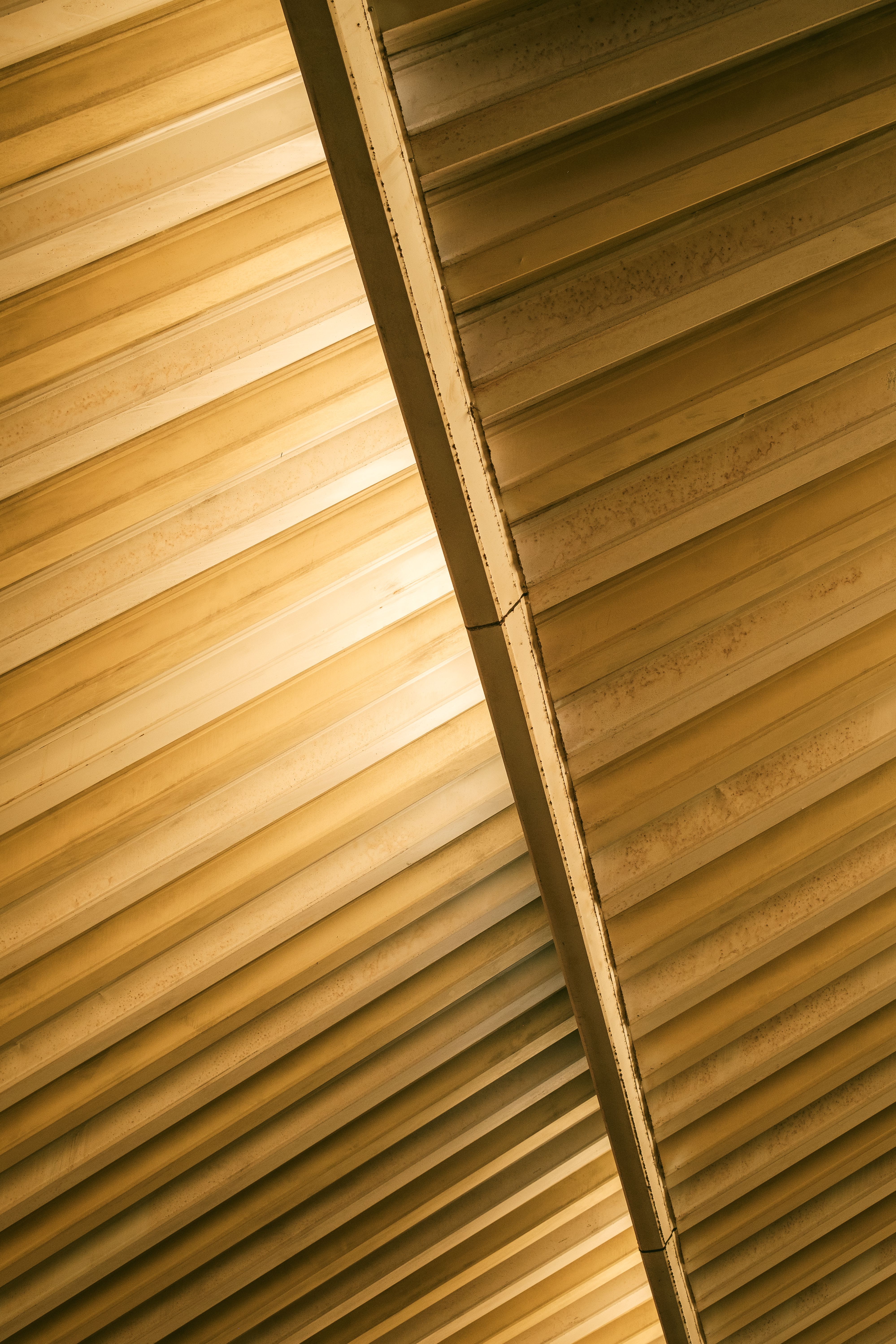 Abstract Golden Metal Roof Design at Sunset · Free Stock Photo