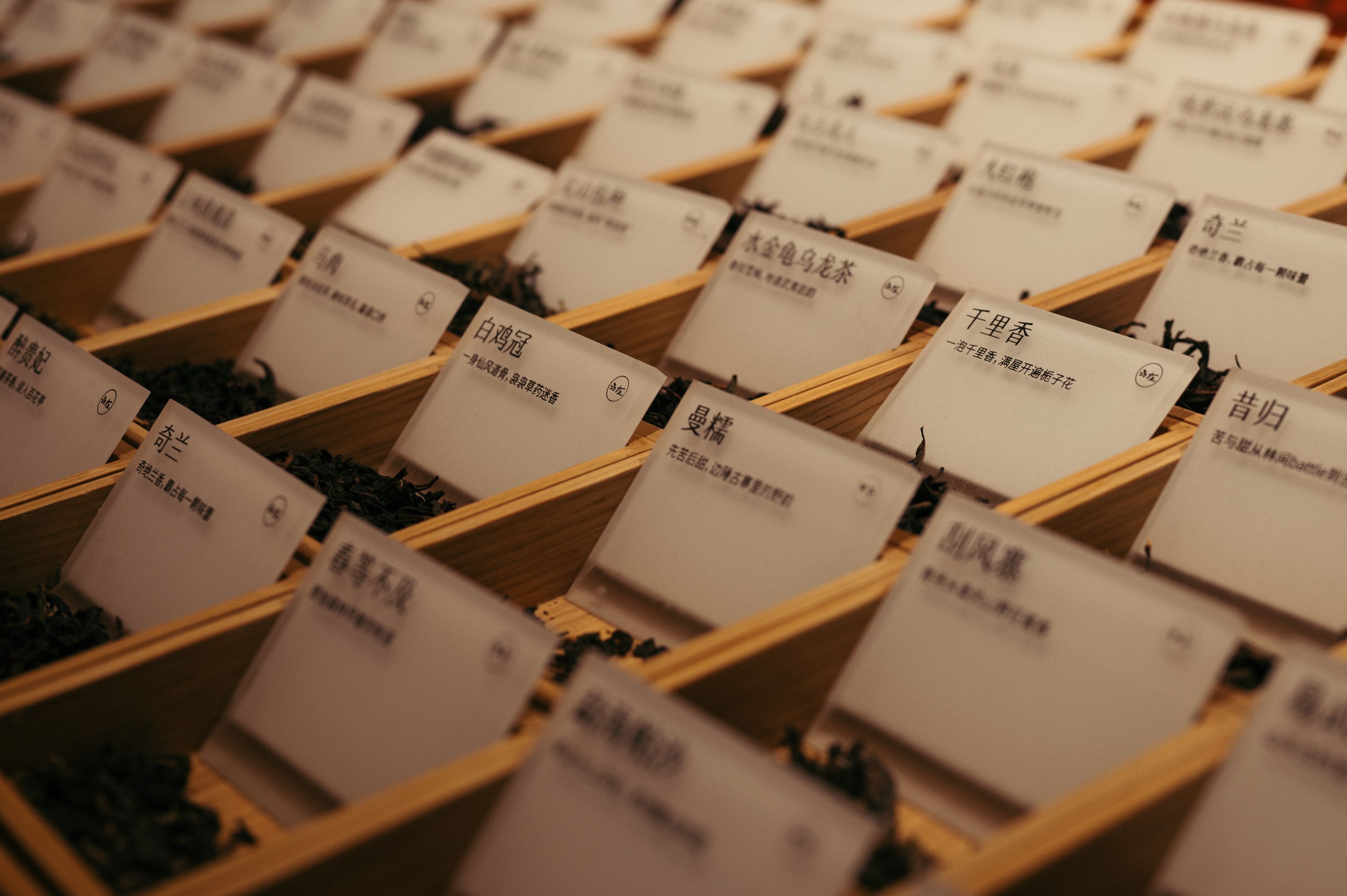 Collection of Tea Leaves in Wooden Compartments · Free Stock Photo