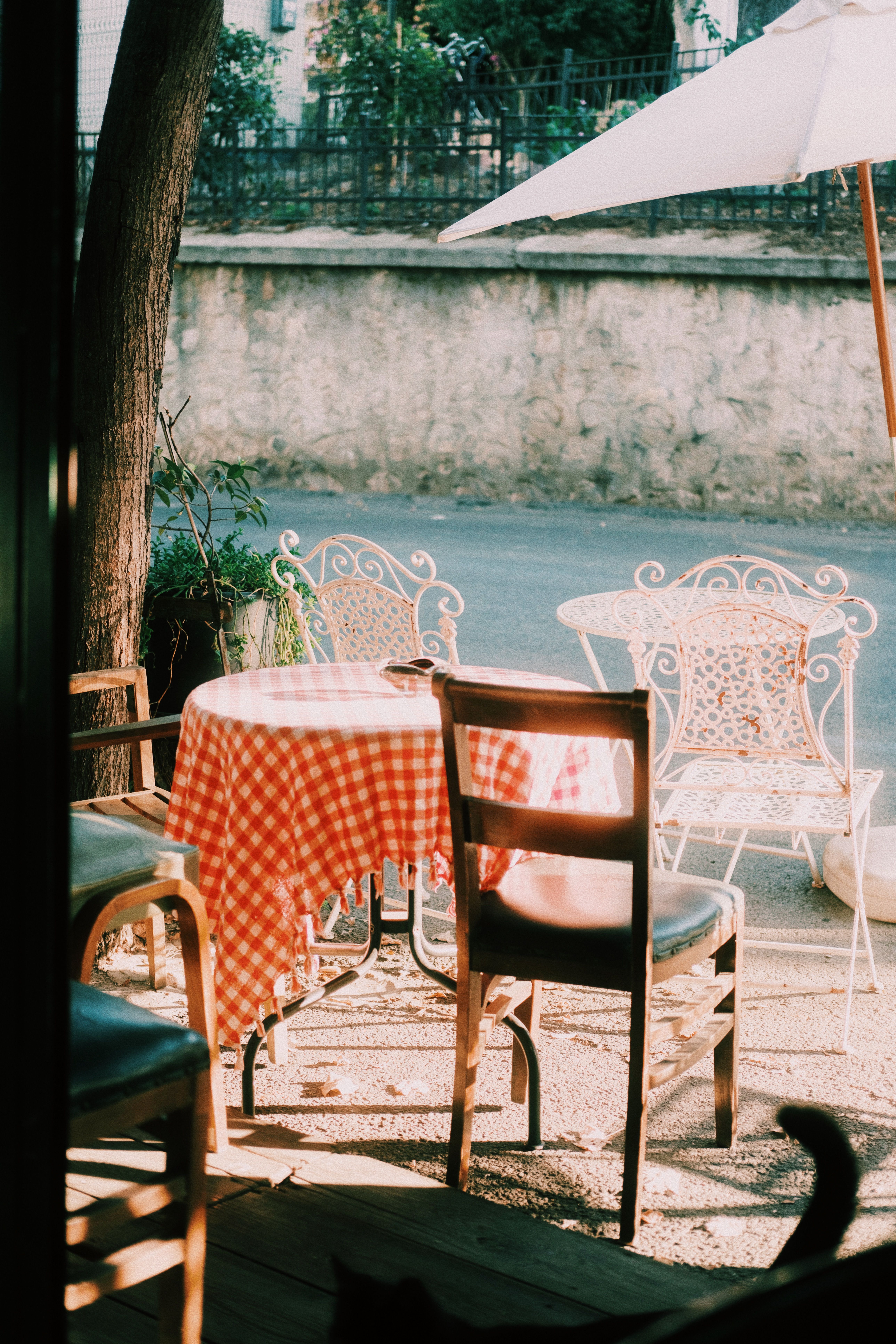 Photography of Red Patio Table With String Lights · Free Stock Photo