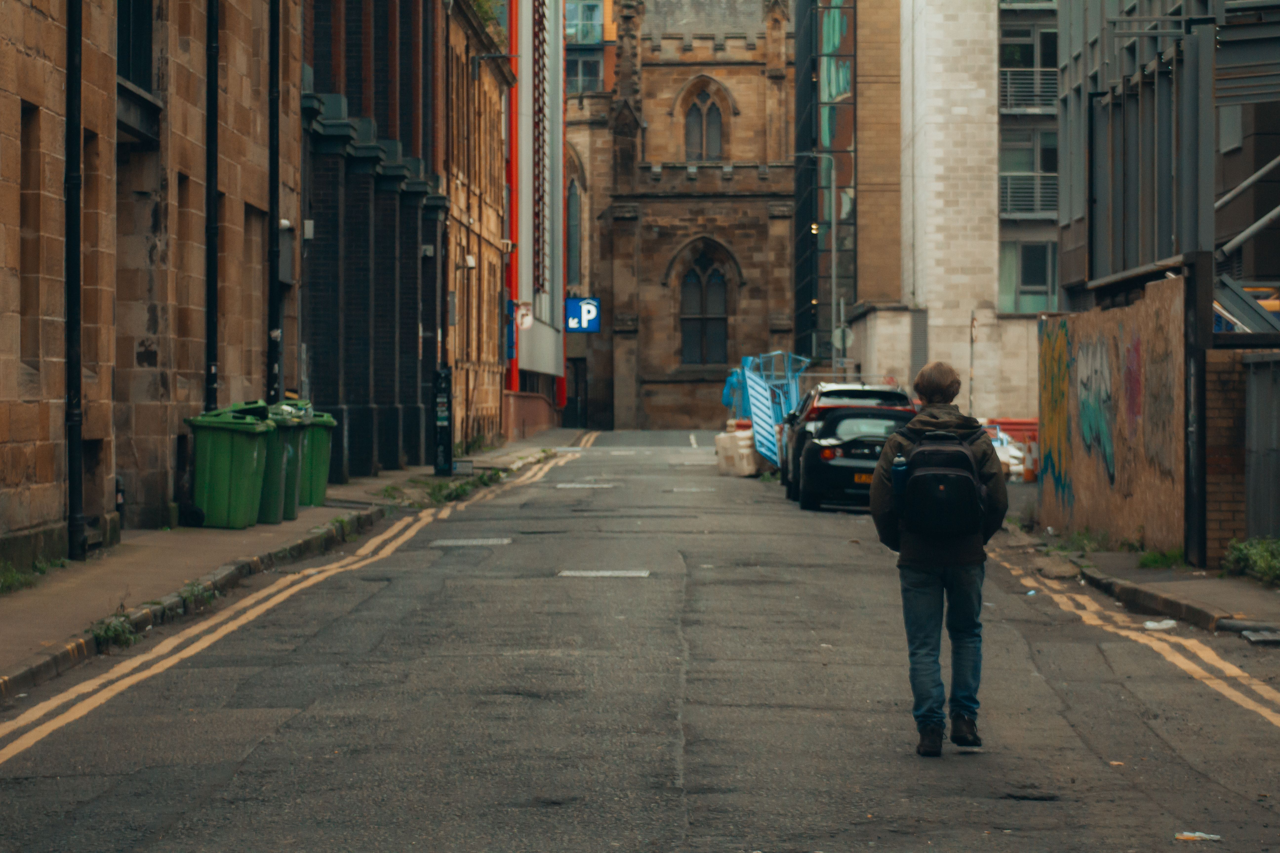 Urban Street Scene with Person Walking Away · Free Stock Photo