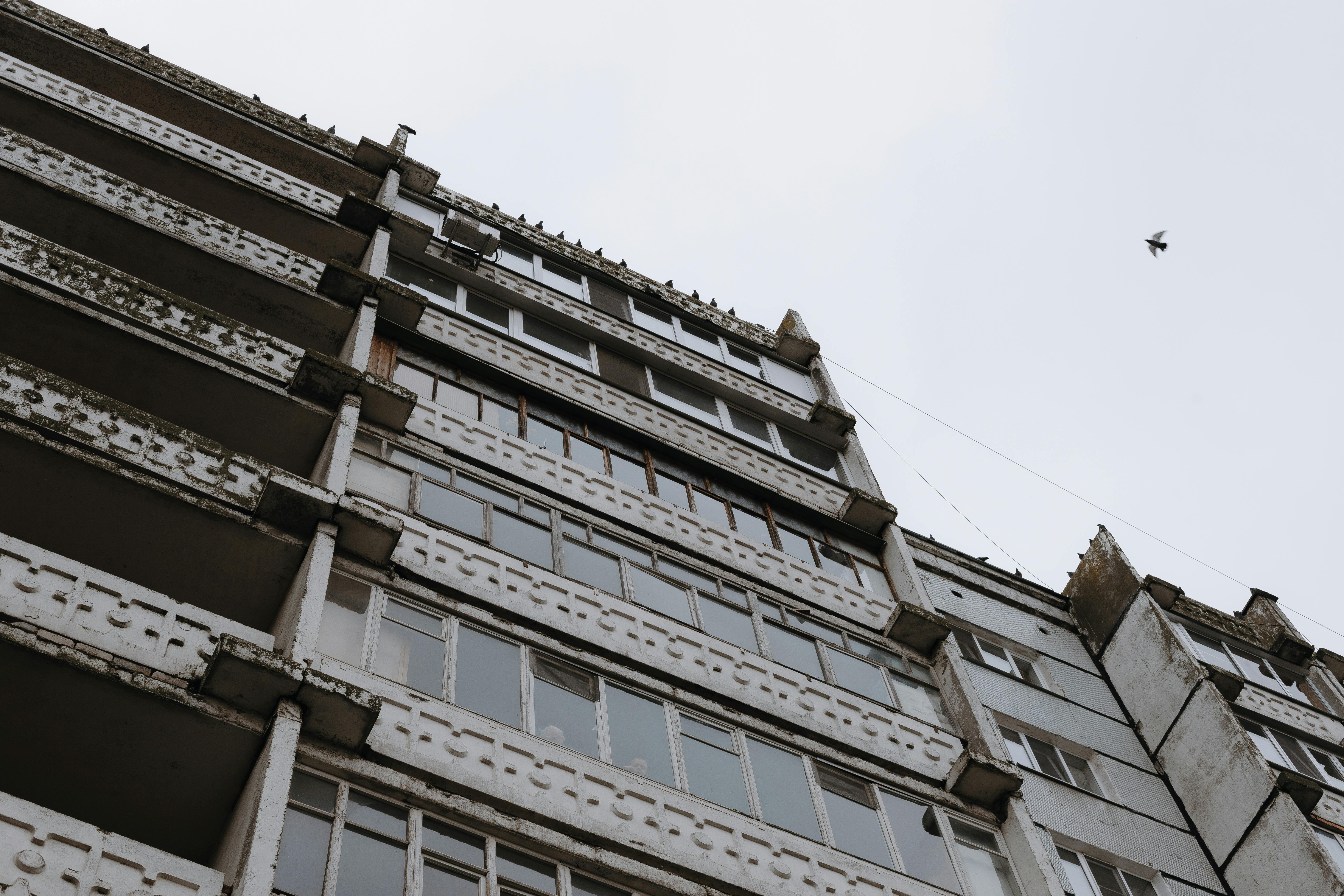 Old Apartment Building with Weathered Facade · Free Stock Photo