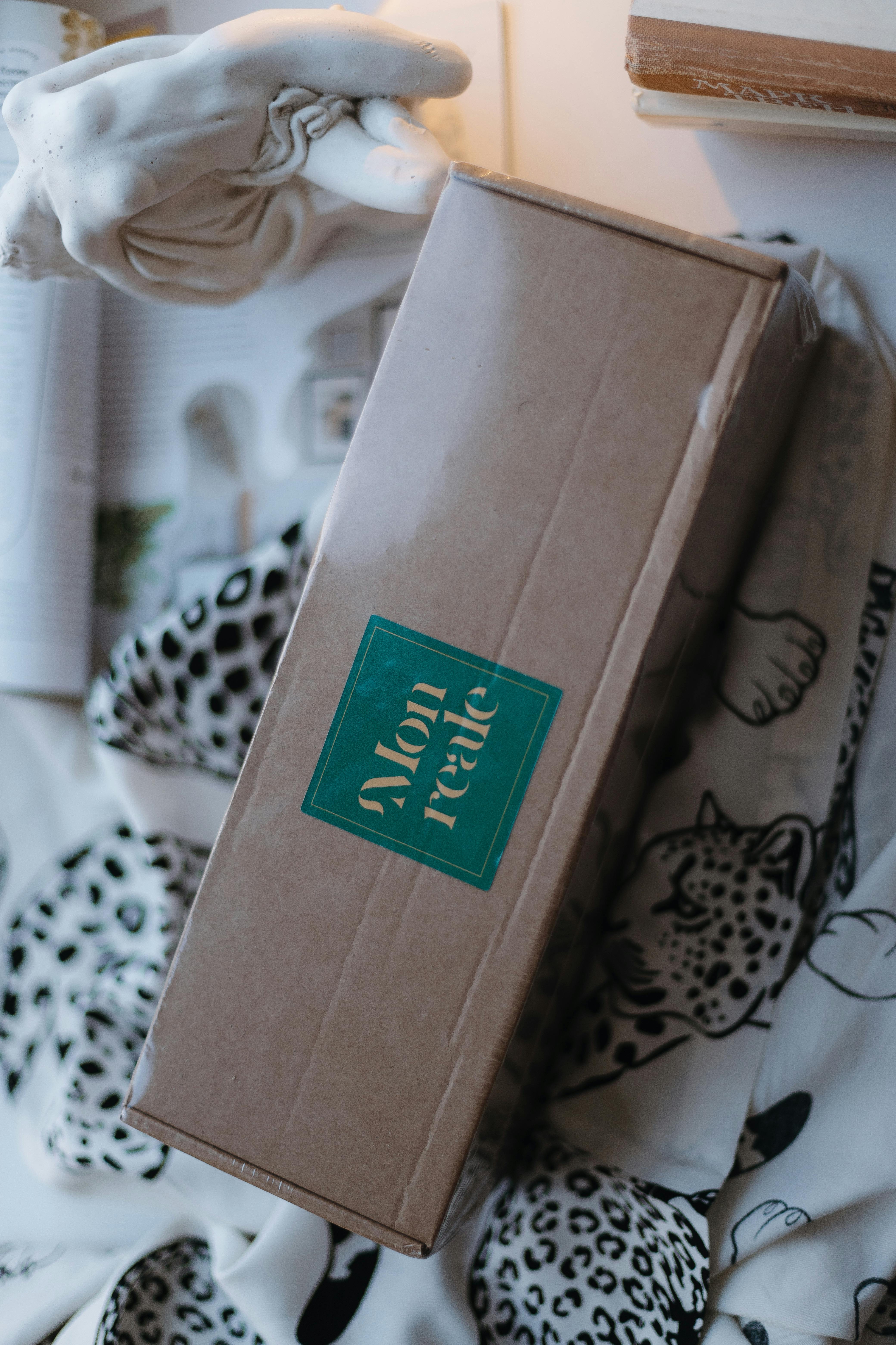 Cardboard Box on Leopard Print Fabric · Free Stock Photo