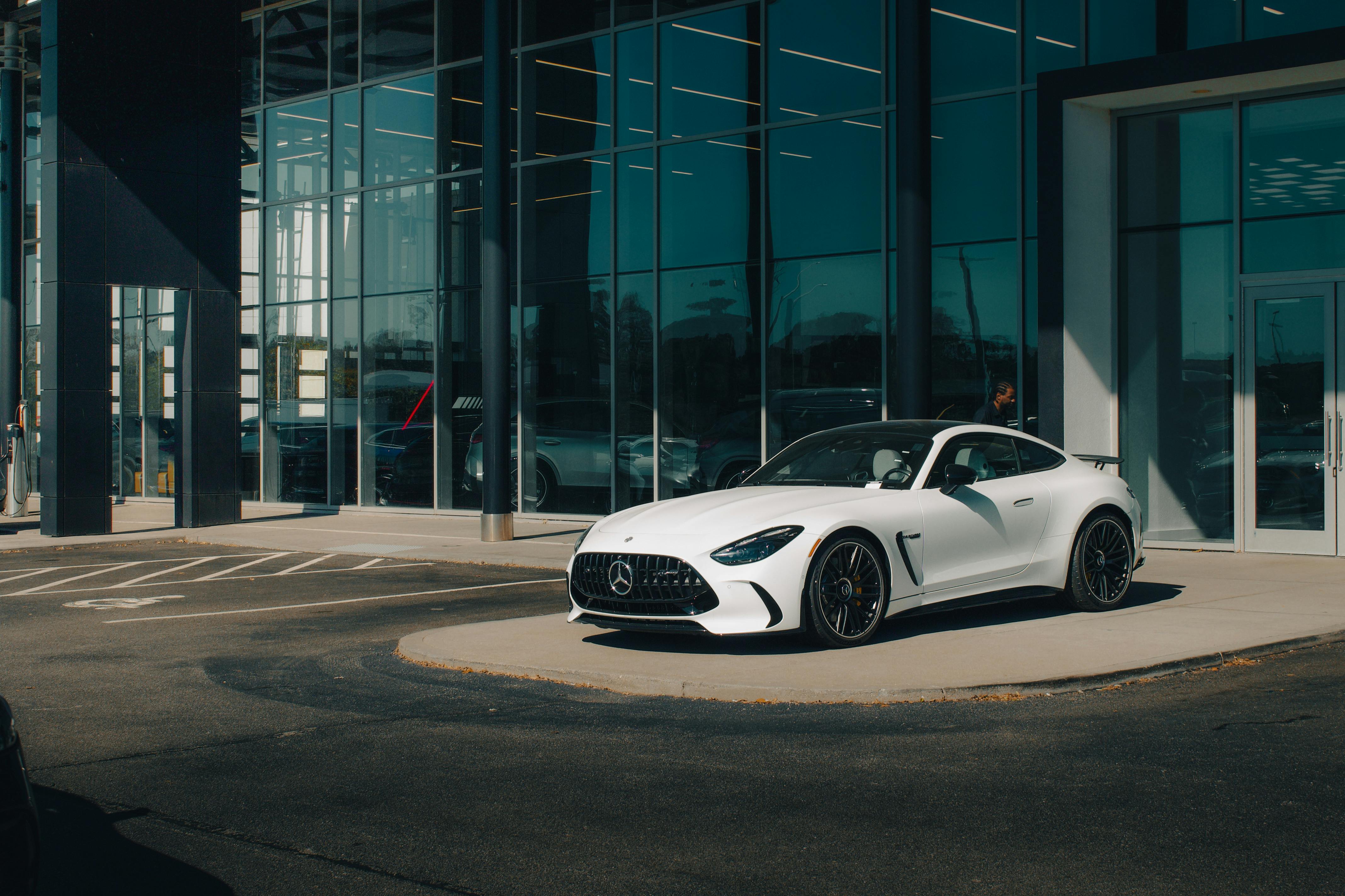 Sleek Mercedes Benz Parked at Modern Dealership · Free Stock Photo