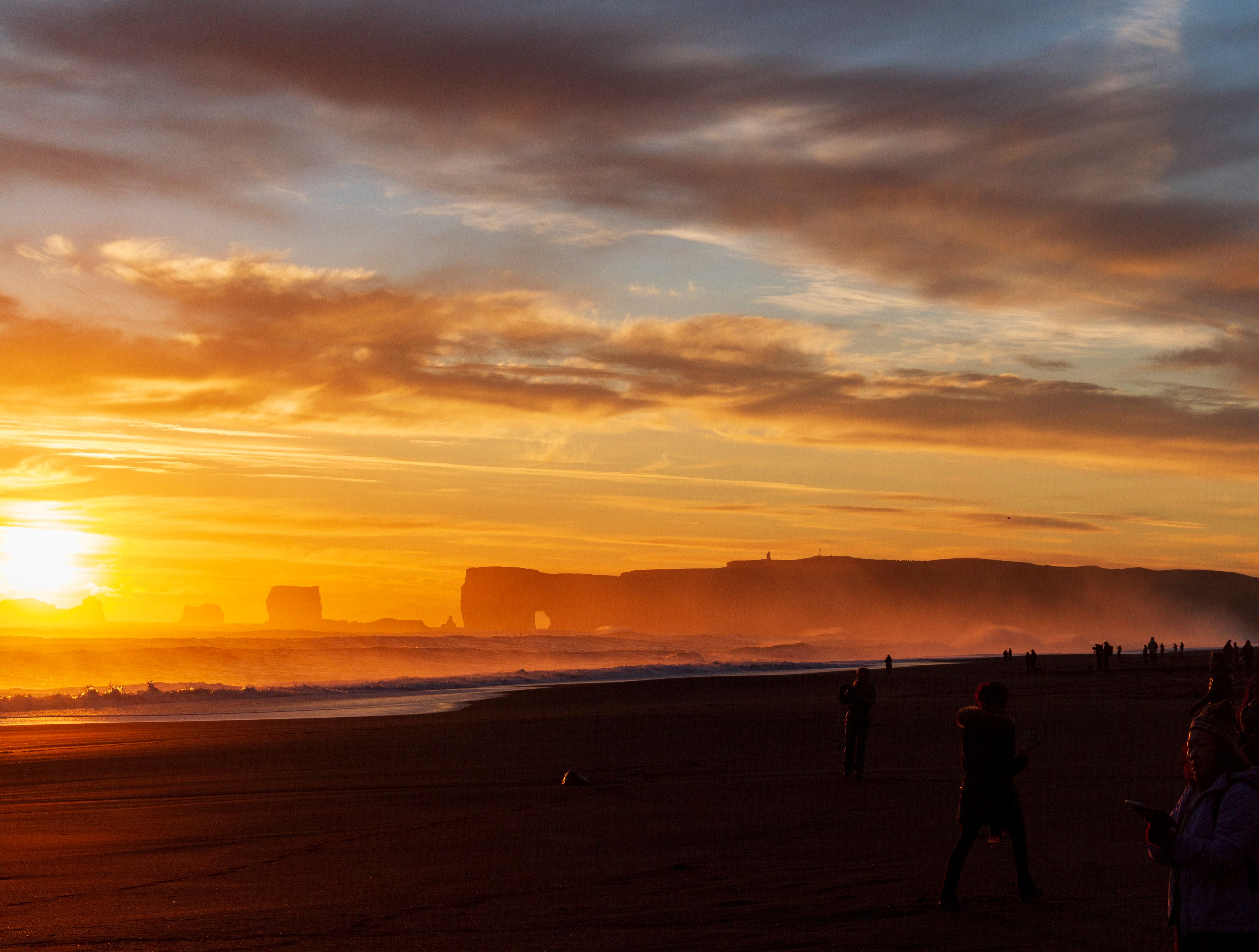 Dramatic Sunset over a Black Sand Beach Island · Free Stock Photo