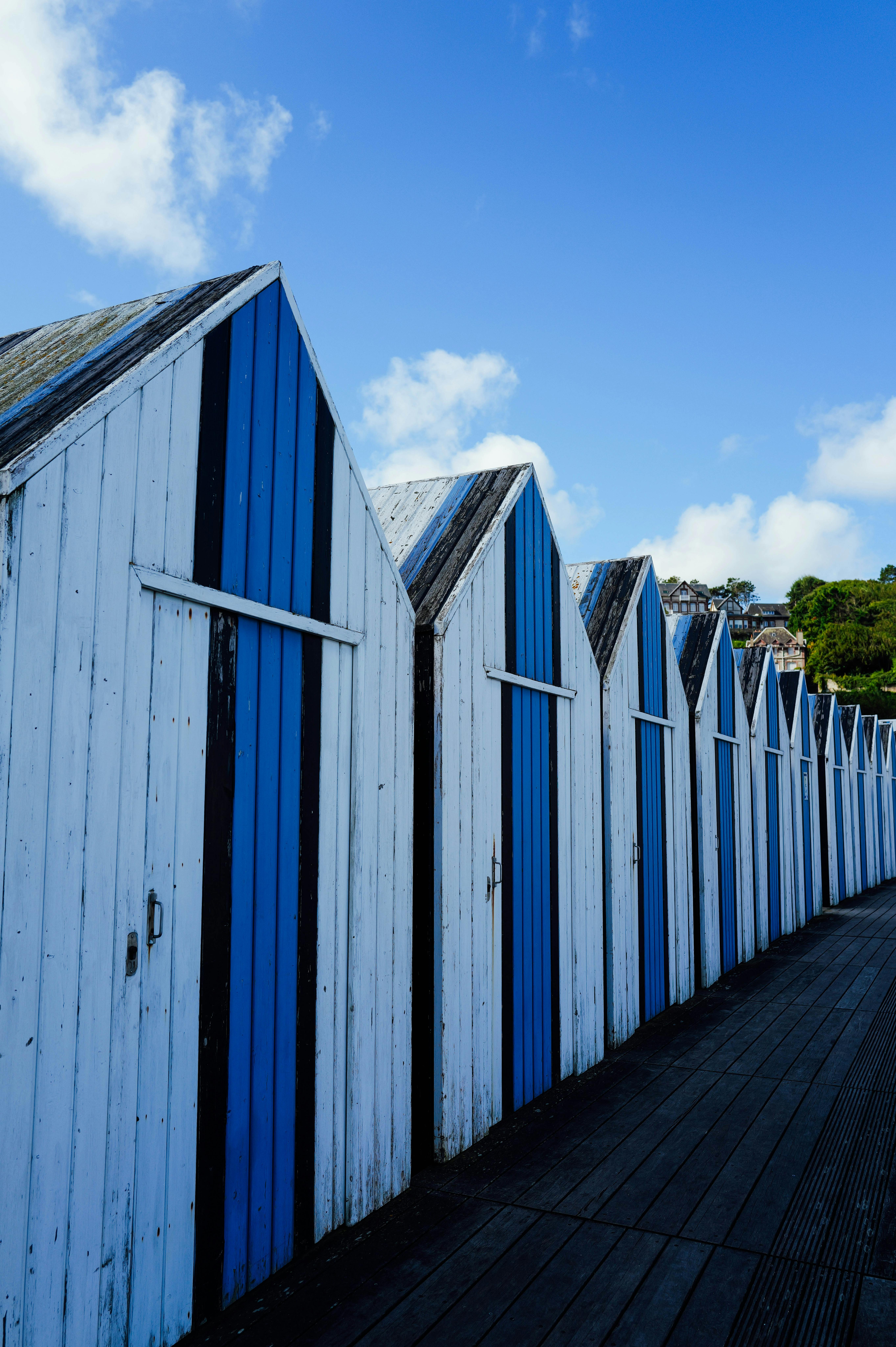 White and Blue Beach Huts by the Seaside · Free Stock Photo