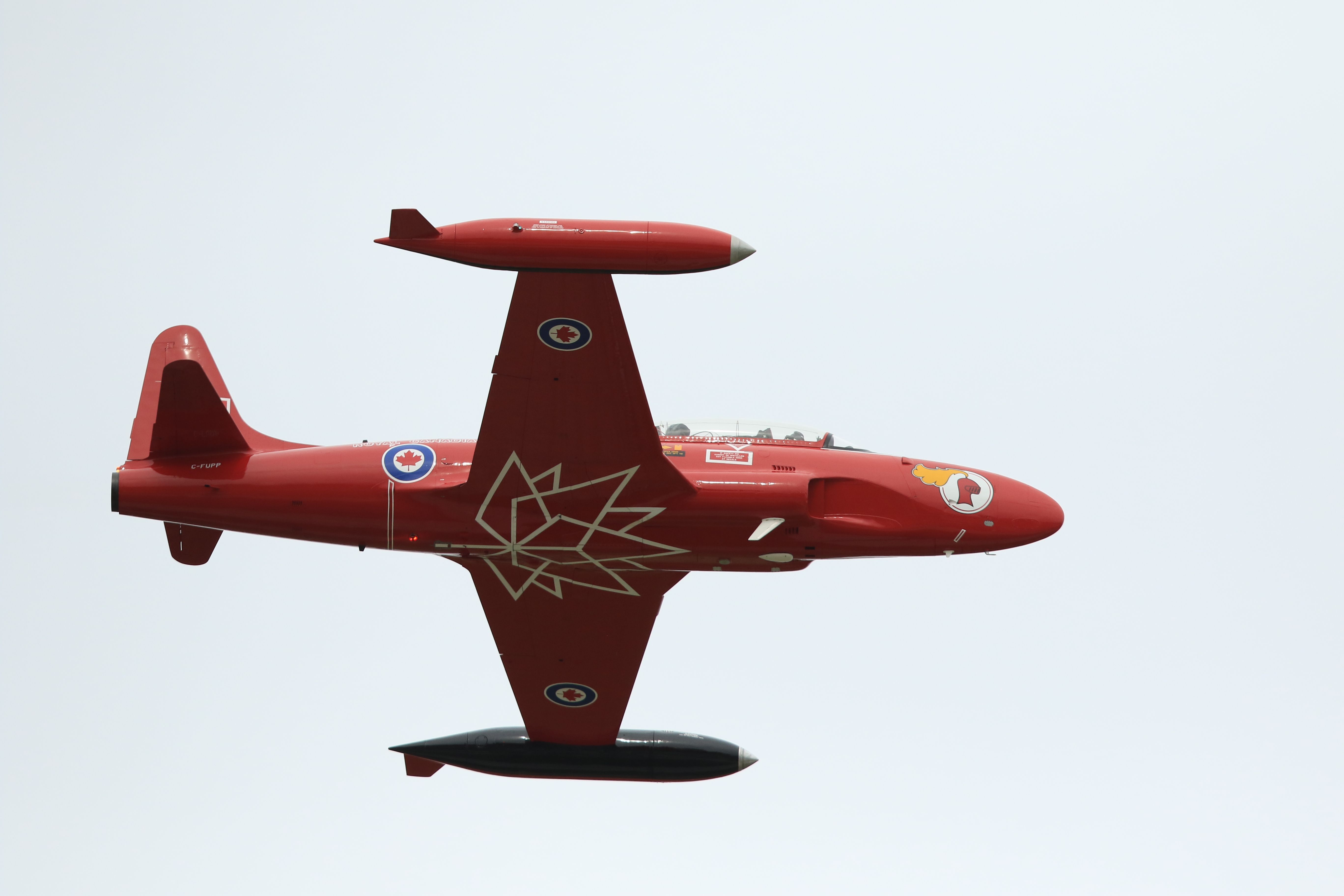 Red Jet Performing Aerial Stunt in Clear Sky · Free Stock Photo