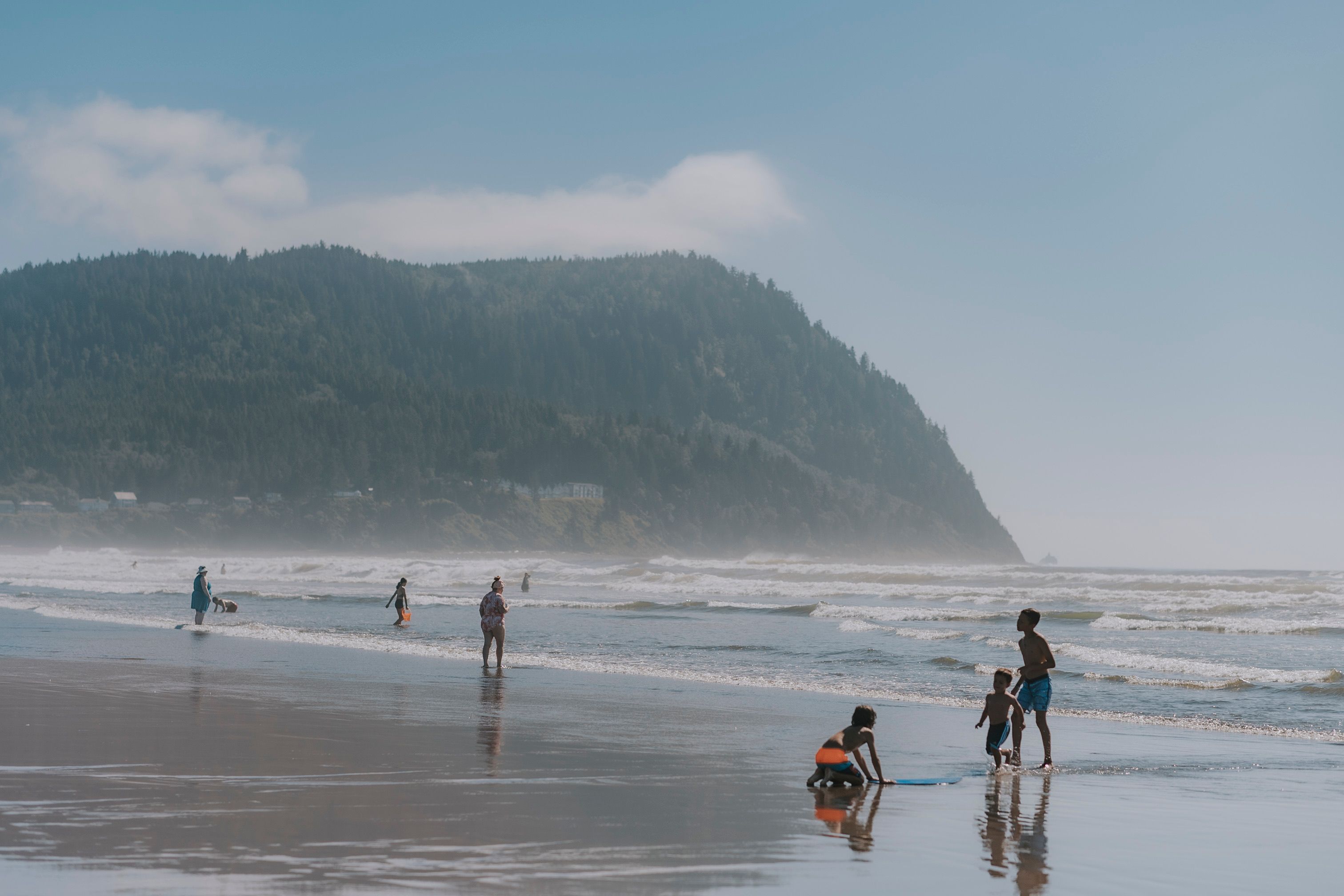 Families Enjoying a Relaxing Day at the Beach · Free Stock Photo