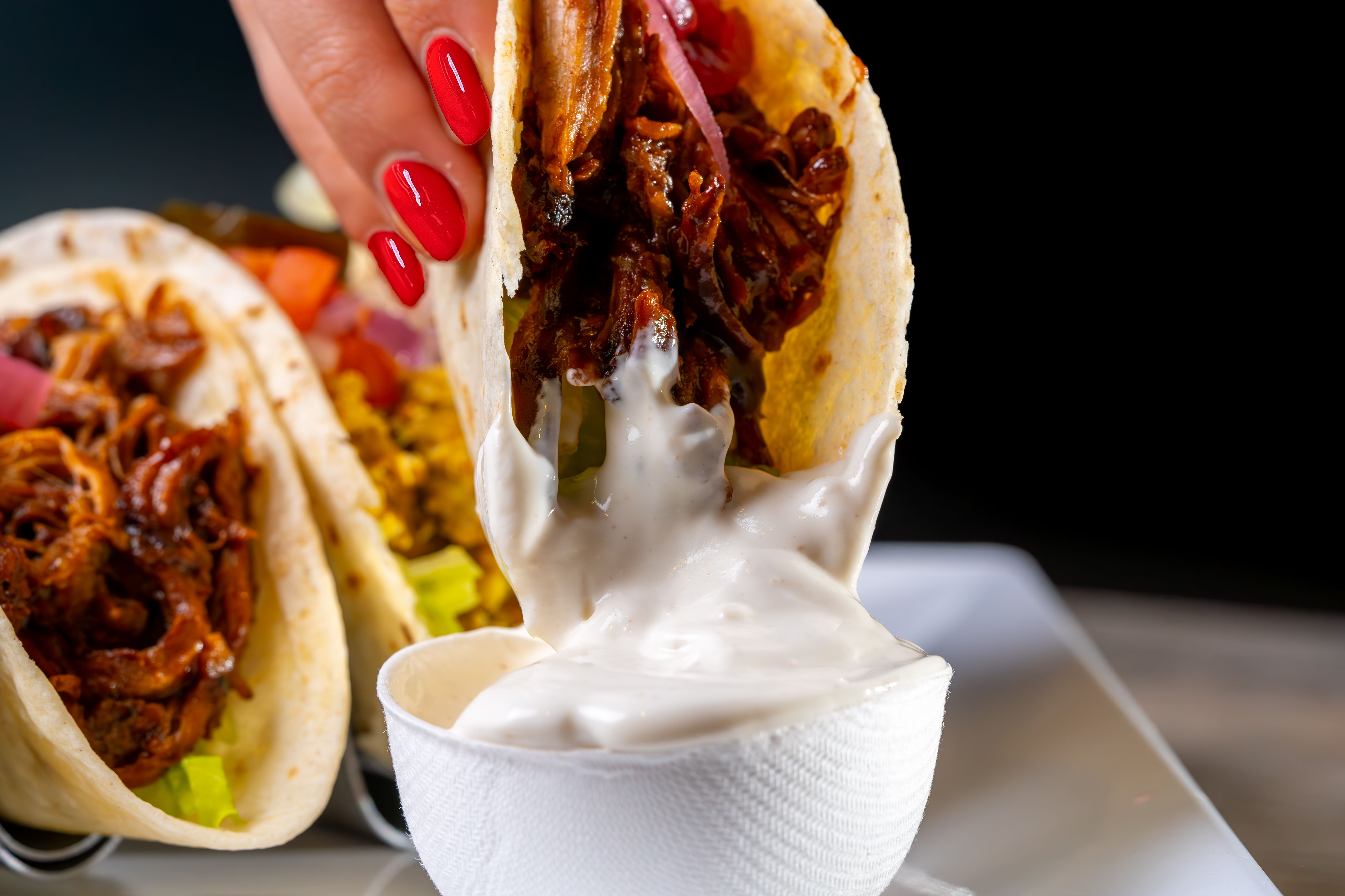 Delicious Tacos Dipped in Creamy Sauce · Free Stock Photo