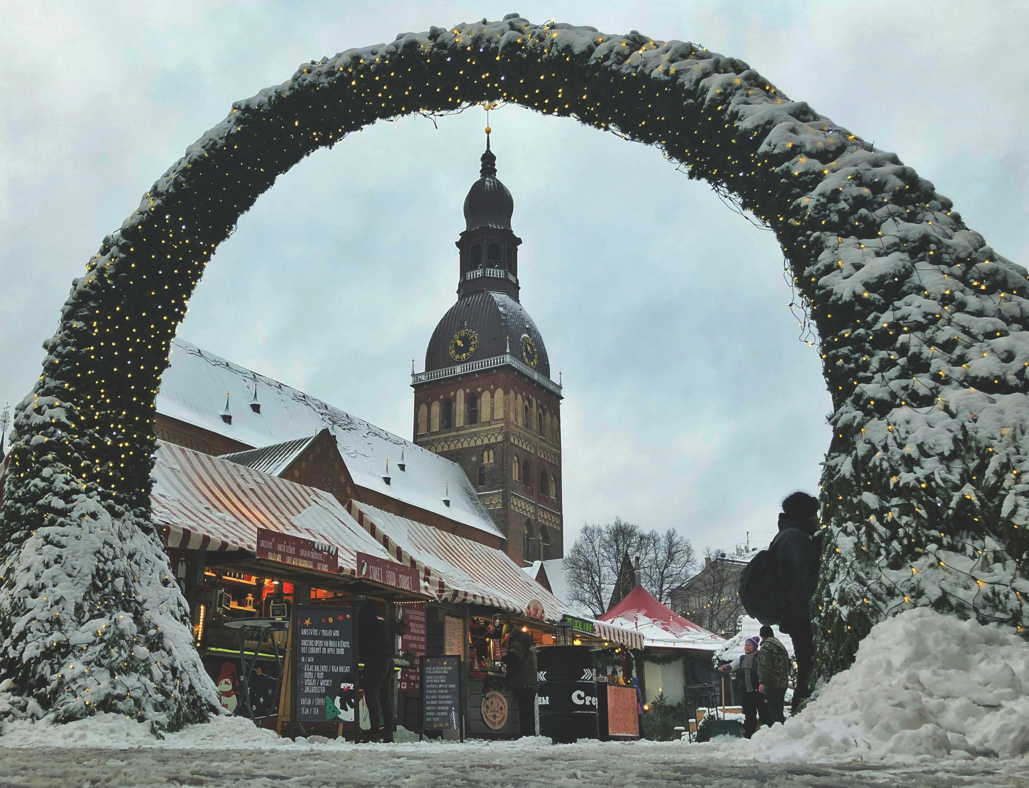 Snowy Market Scene with Cathedral Tower · Free Stock Photo