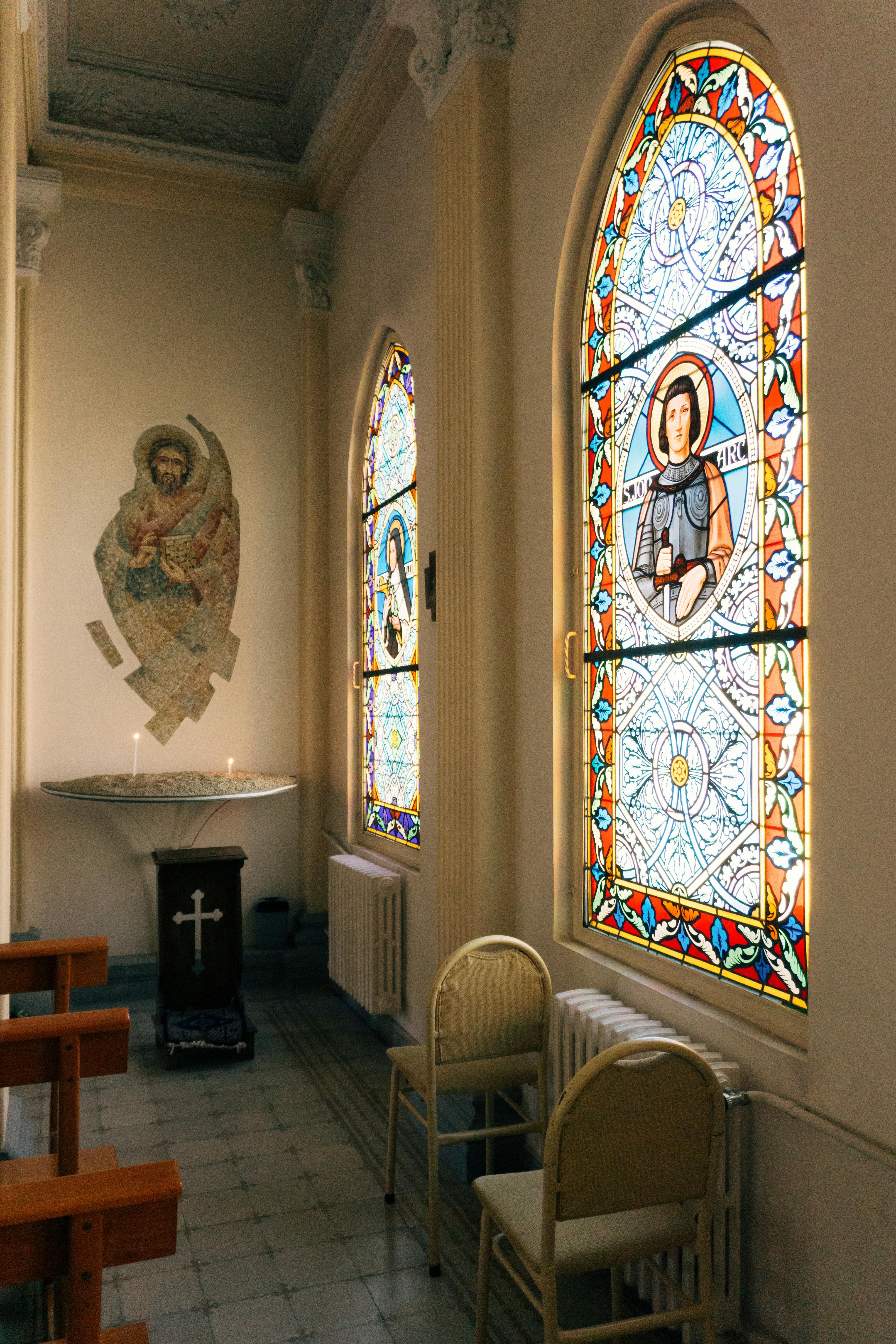 Stained Glass Windows in Serene Chapel Interior · Free Stock Photo