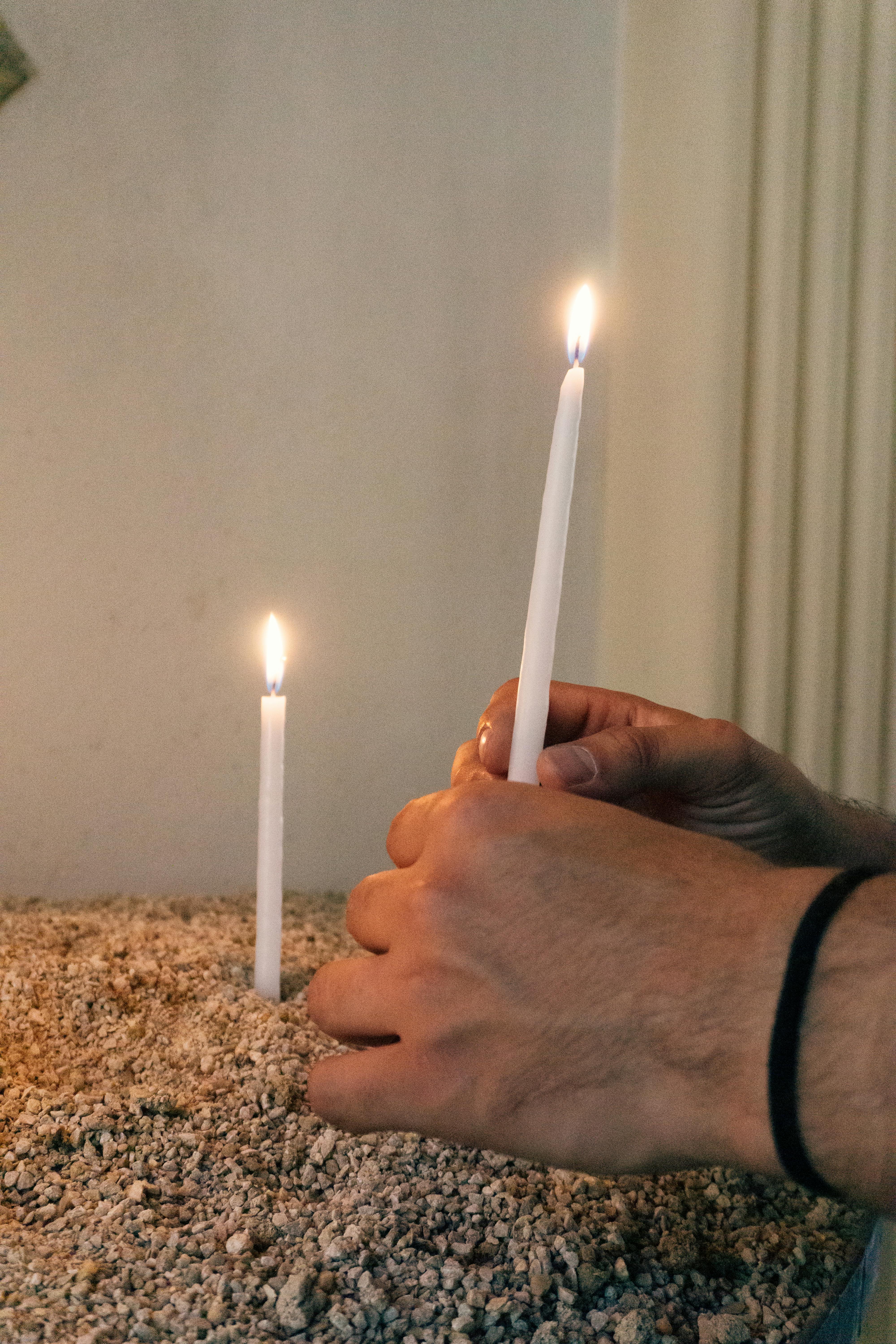 Candle Lighting Ceremony with Two Hands · Free Stock Photo