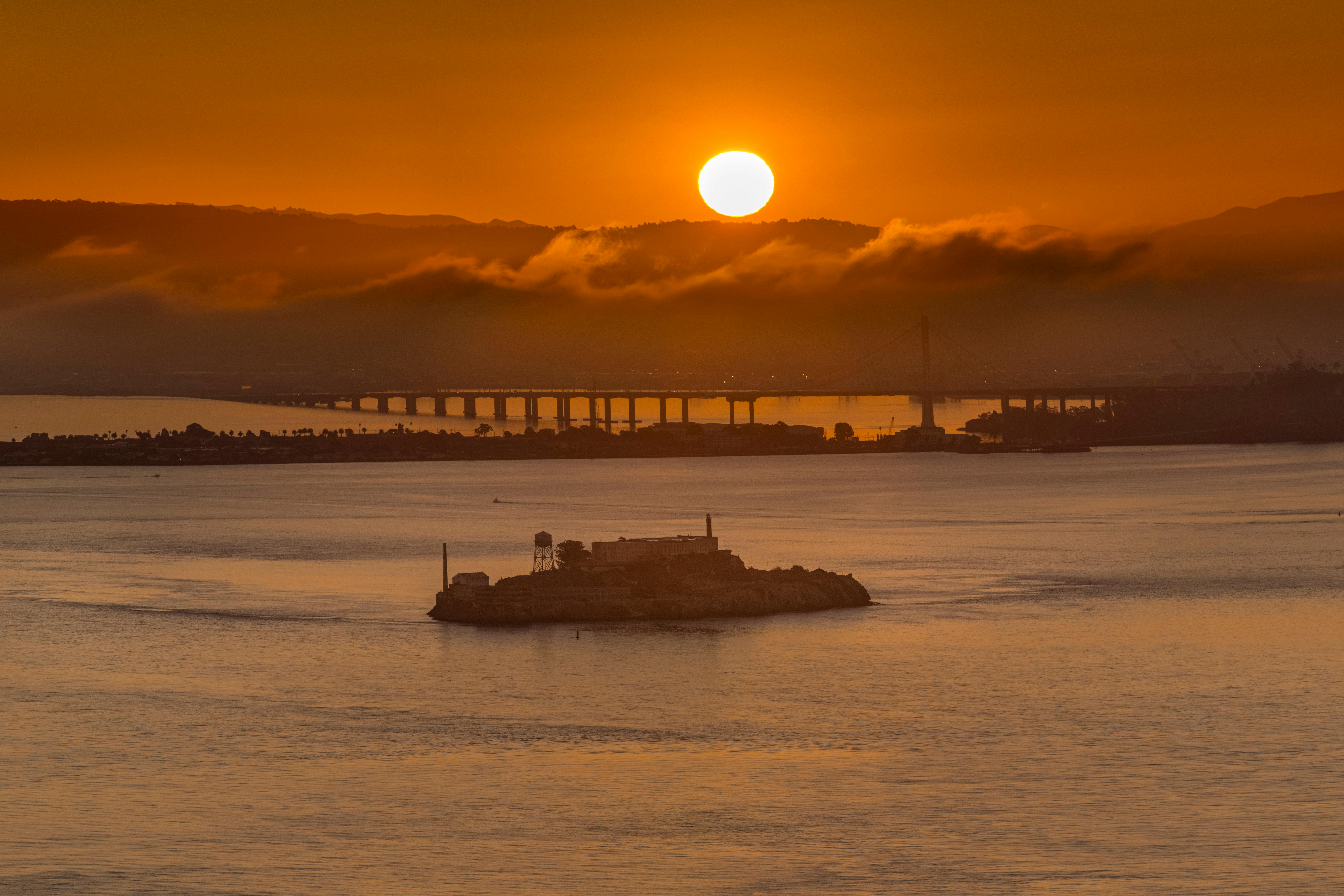 Golden Sunset over Alcatraz Island and Bay Bridge · Free Stock Photo
